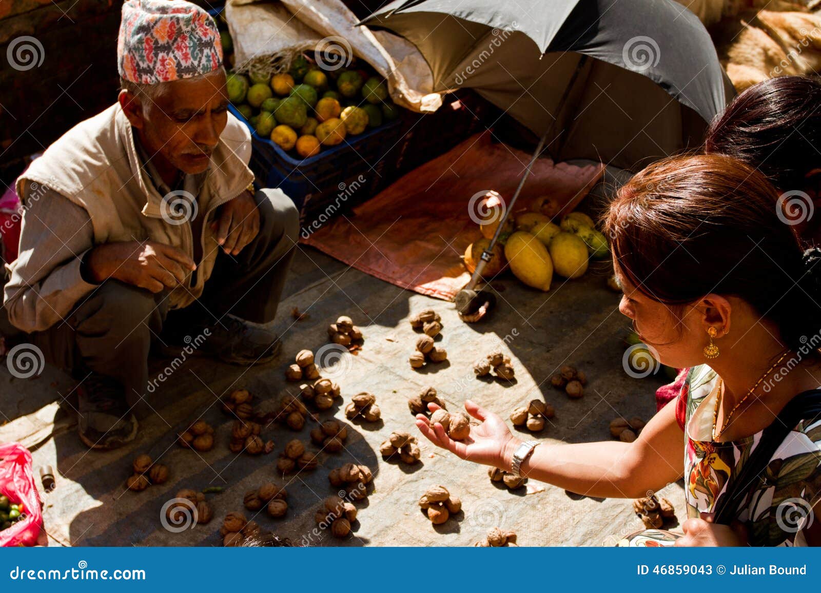 Walnut Trader on the Streets of Kathmandu, Nepal with Customer ...