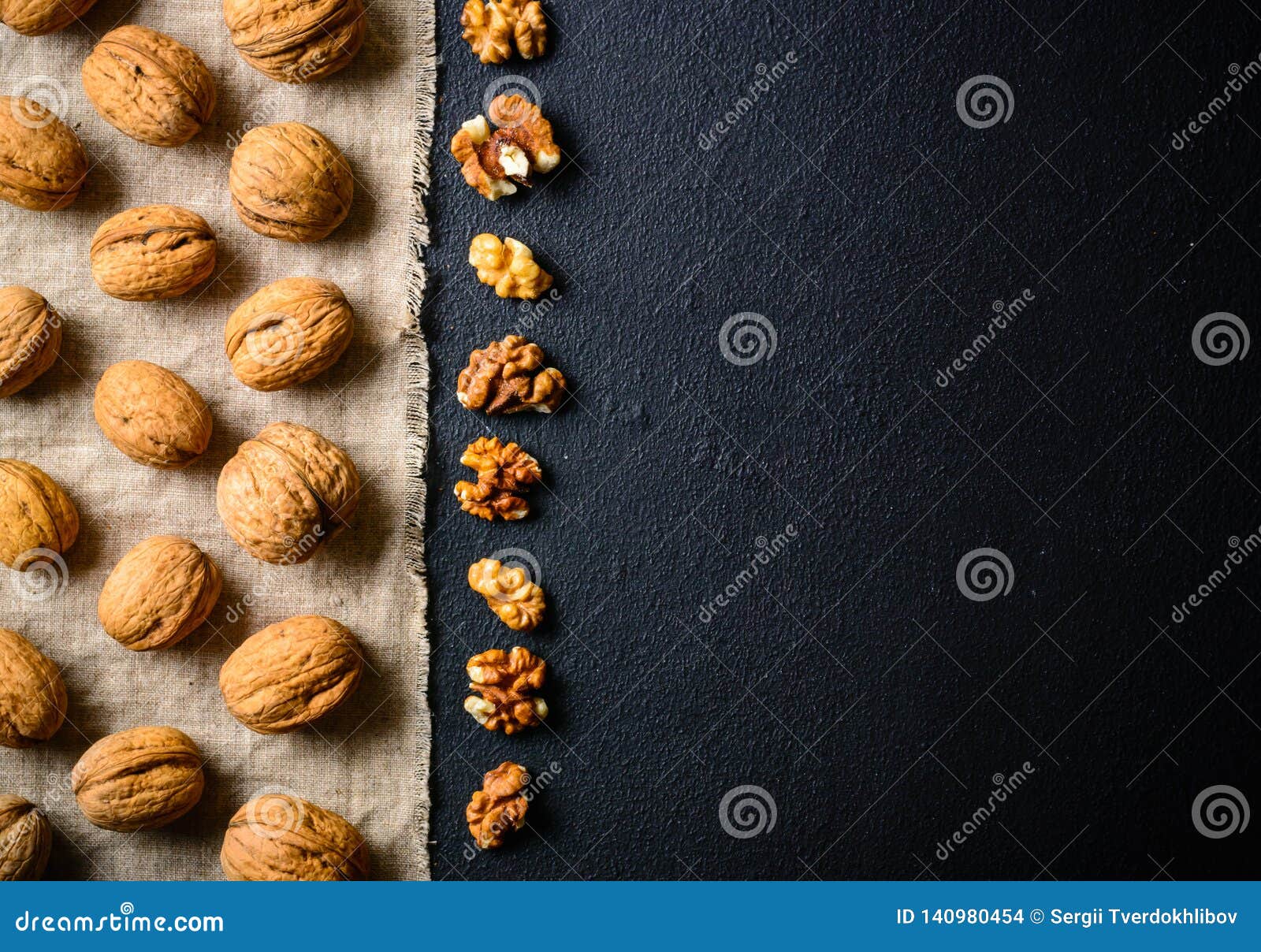 Walnuts on a Black Slate. Whole and Peeled Nuts. Walnuts Spread Out ...