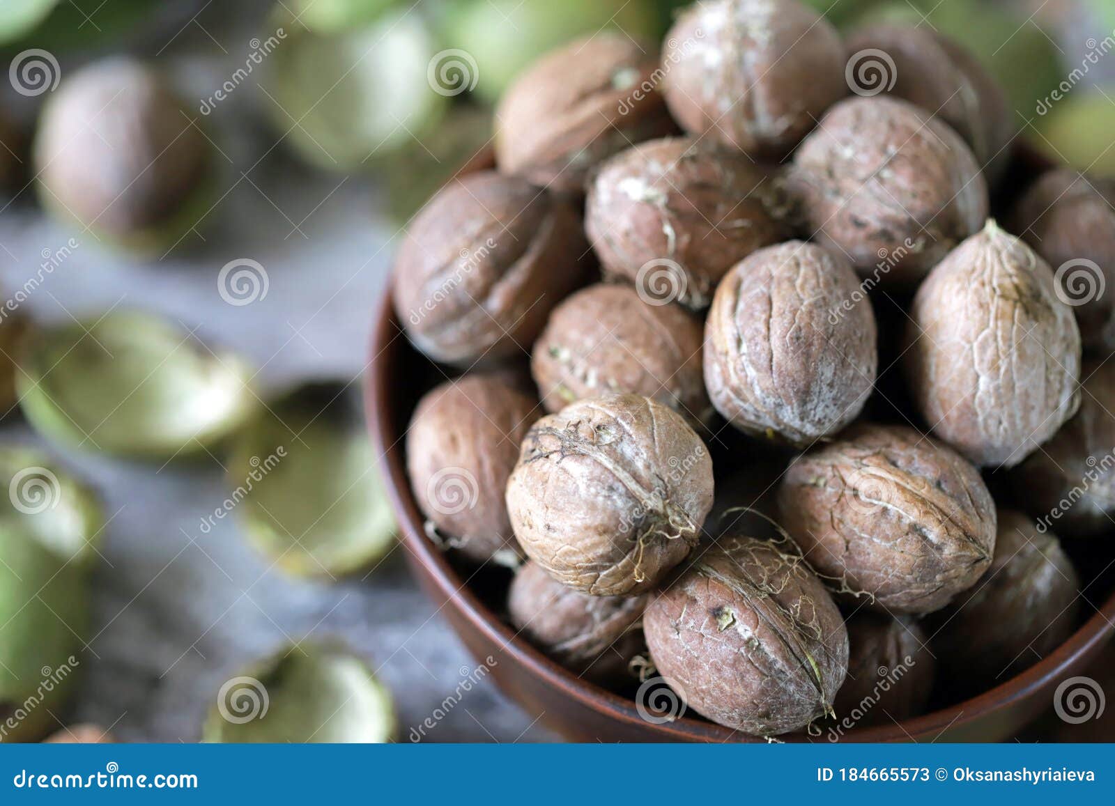 Walnuts in a Bowl. the Leaves of the Walnut Tree. Walnuts in a Green ...