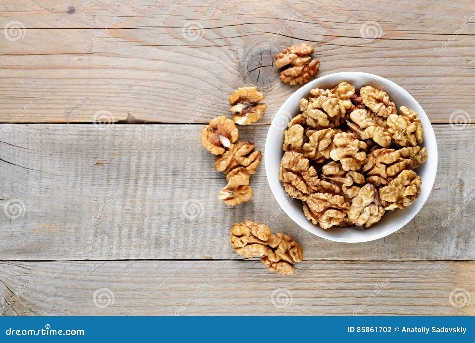 Walnuts in Bowl on Wooden Table Stock Photo - Image of bowl, kernel ...
