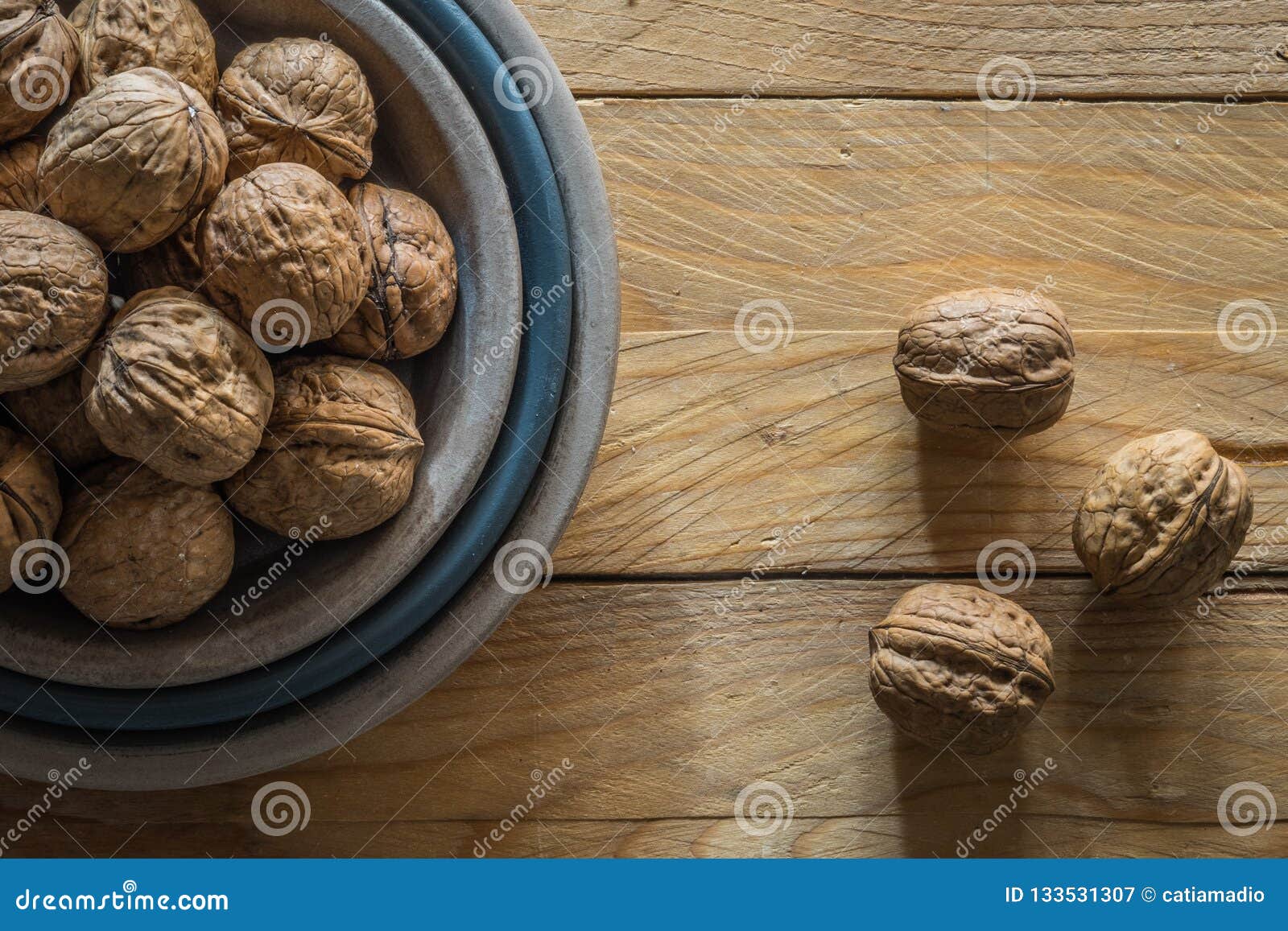 Walnuts Closeup Inside Plate Over Wooden Board Stock Image - Image of ...