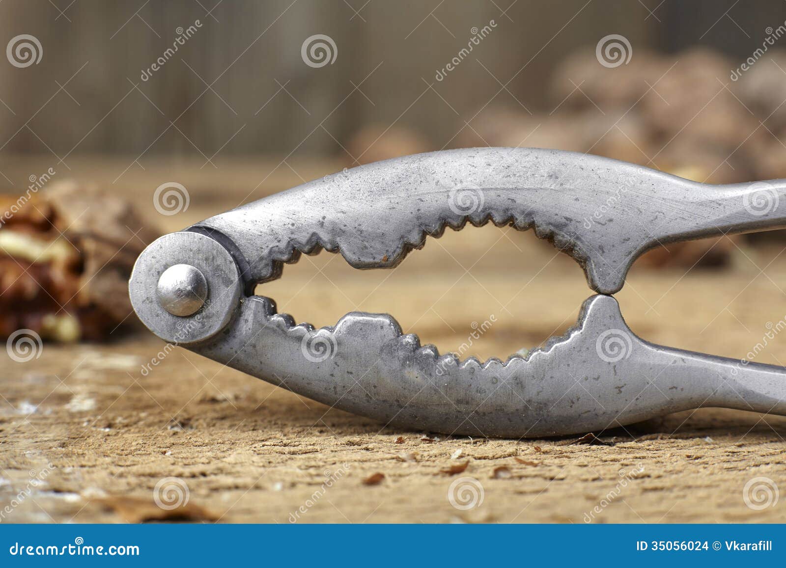 Walnuts Cracked Open with a Nut Cracker Stock Photo - Image of wooden ...