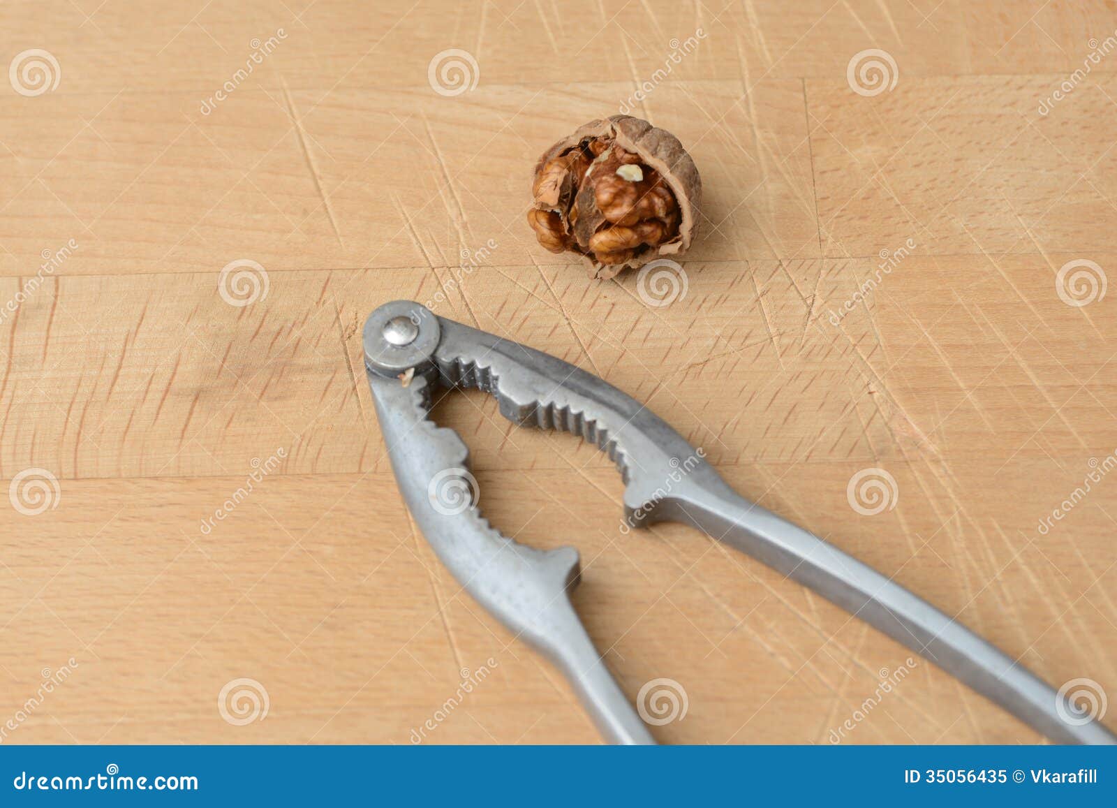 Walnuts Cracked Open with a Nut Cracker Stock Image - Image of cracked ...