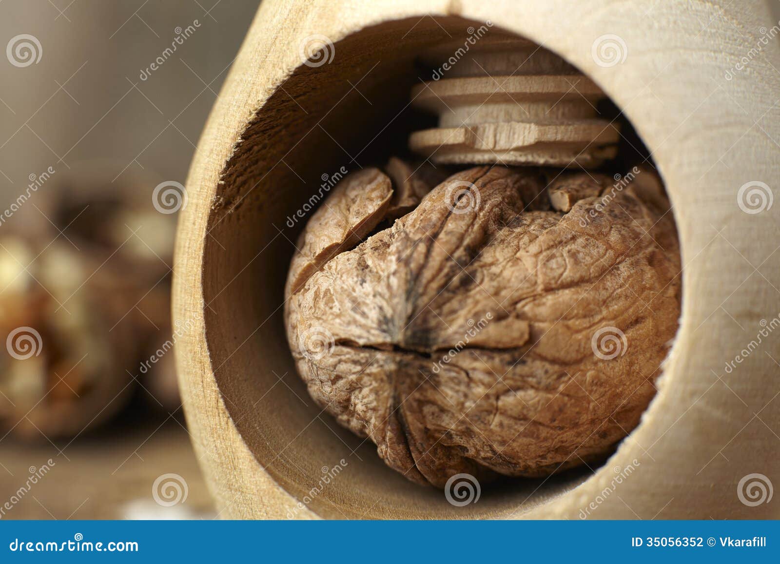 Walnuts Cracked Open with a Wooden Nut Cracker Stock Photo - Image of ...