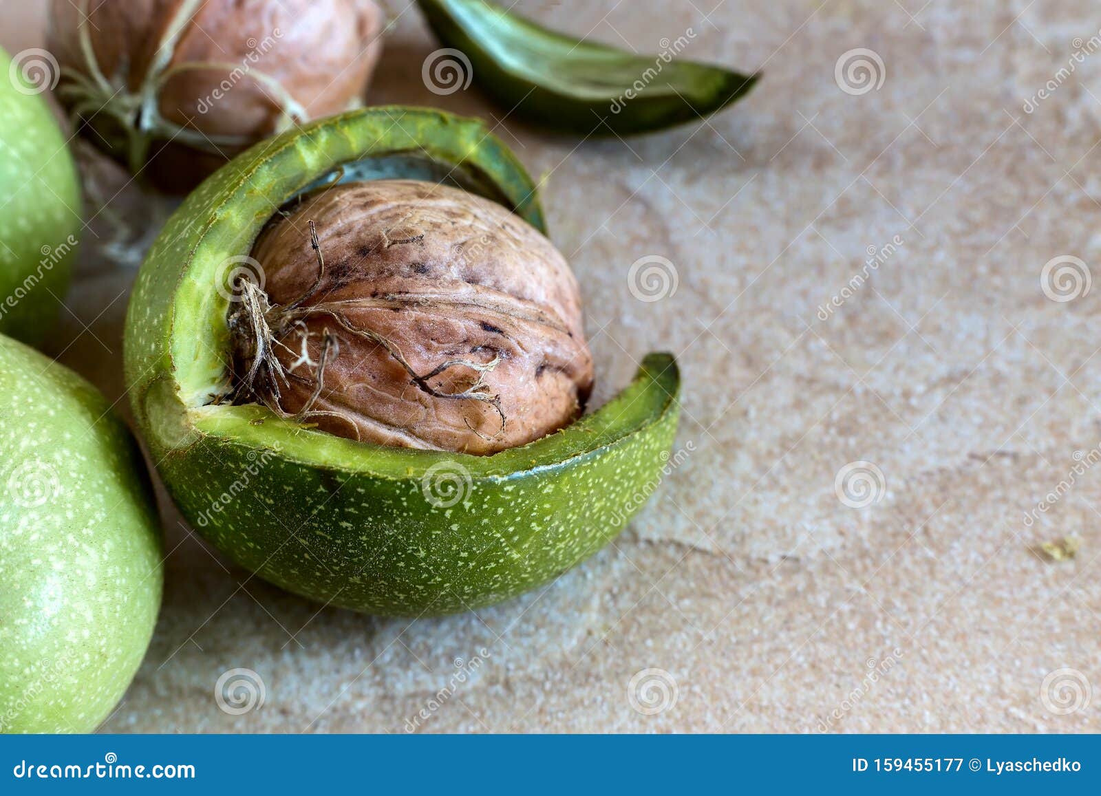 Walnuts in a Green Shell on the Table Stock Image - Image of pile ...