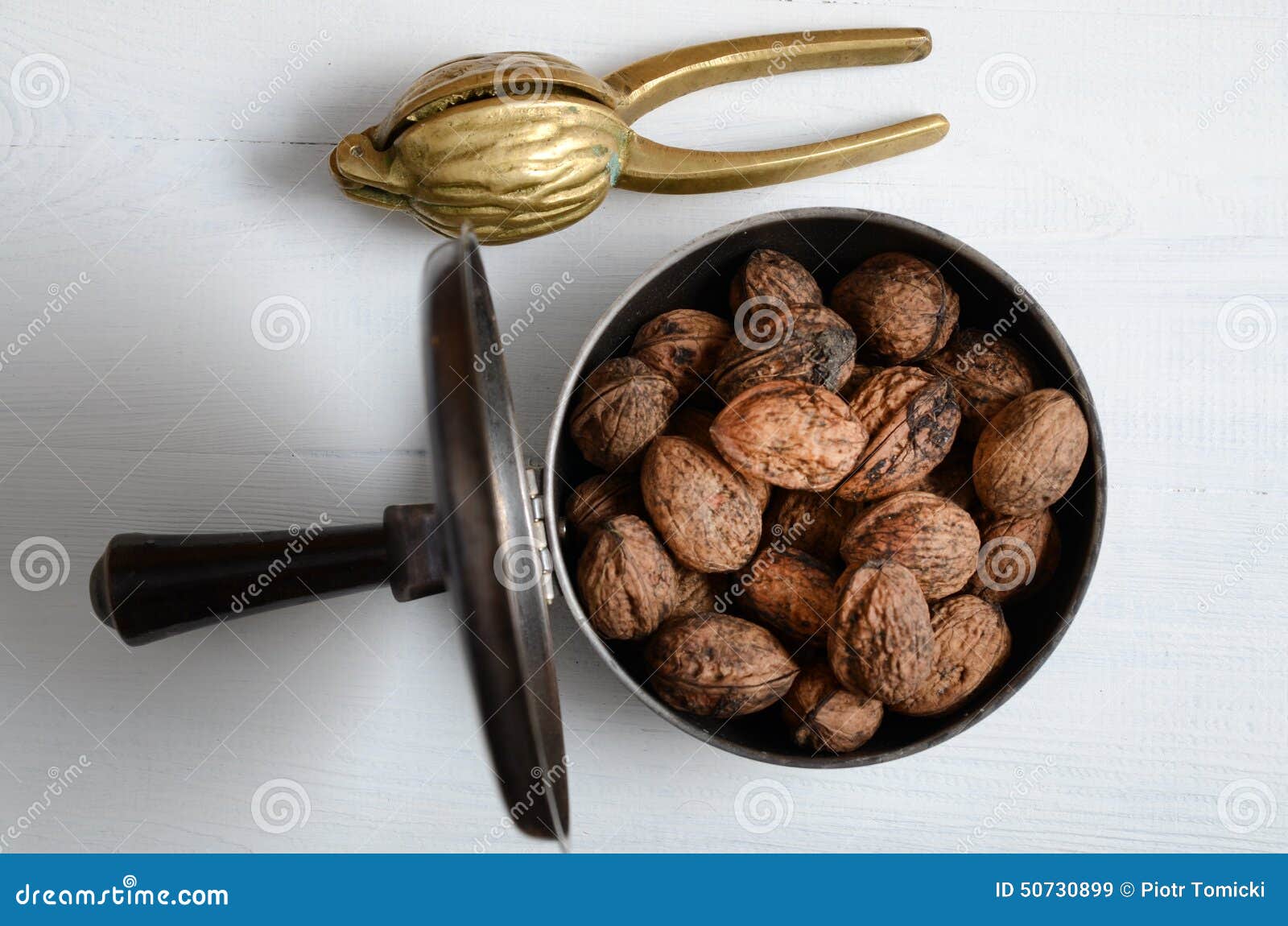 Walnuts and a nutcracker stock image. Image of kernel - 50730899