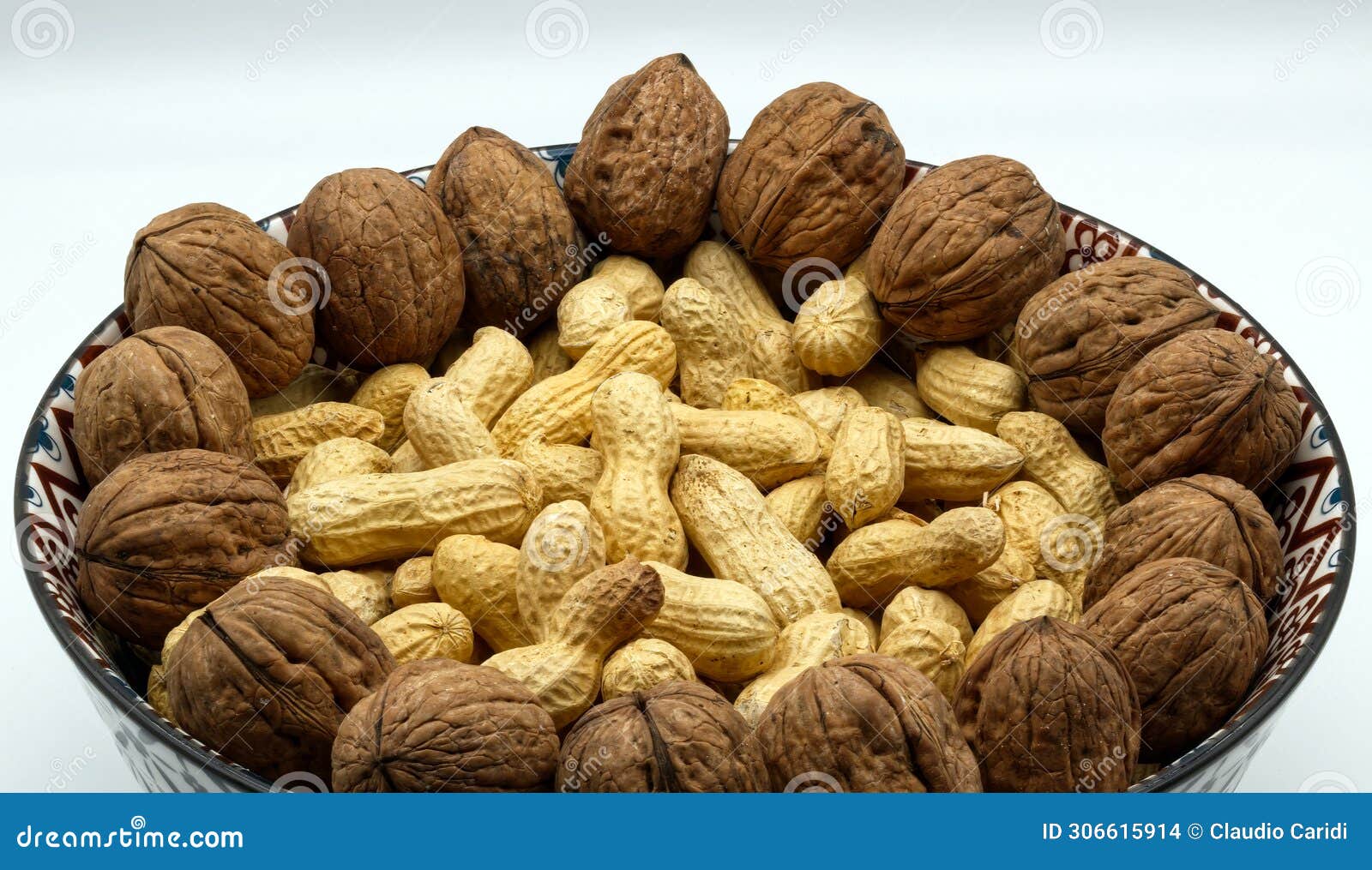 Walnuts and Peanuts in a Bow Isolated on White Stock Photo - Image of ...
