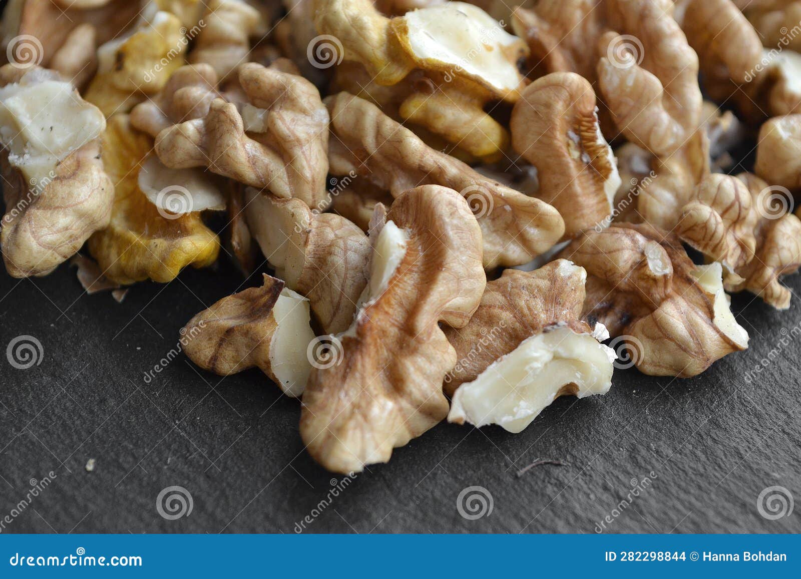 Walnuts Scattered on a Black Background Stock Photo - Image of food ...
