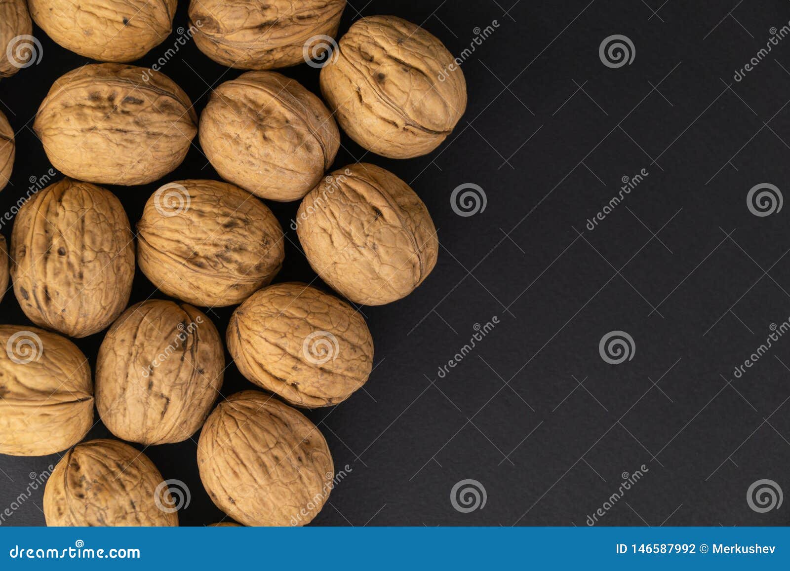Walnuts in Shell on Black Surface, Top View. Background of Round ...