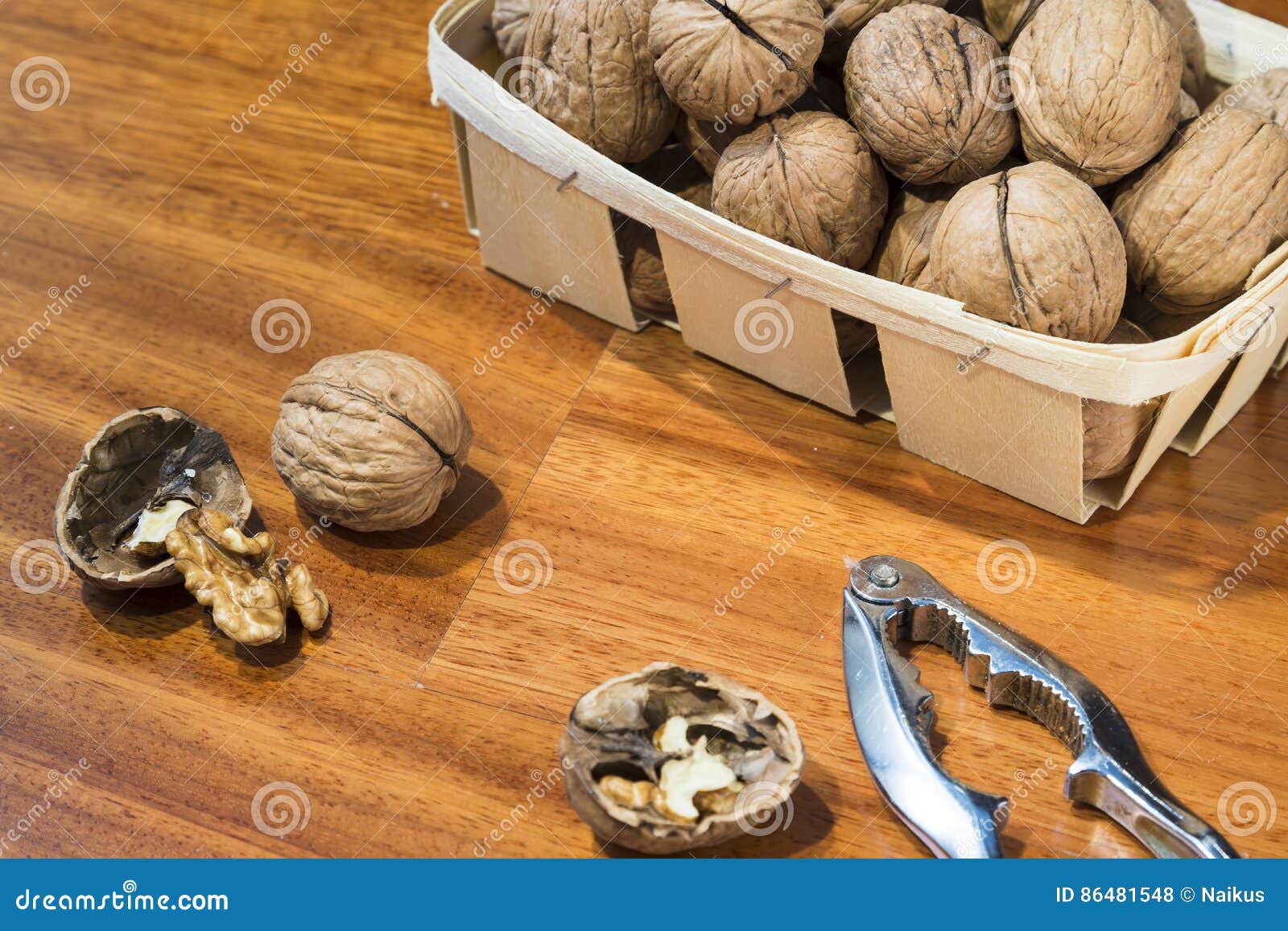 Walnuts in Wicker Basket with Nutcracker Stock Photo - Image of healthy ...