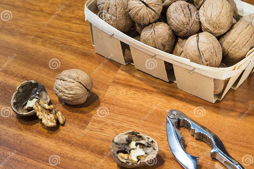 Walnuts in Wicker Basket with Nutcracker Stock Photo - Image of healthy ...