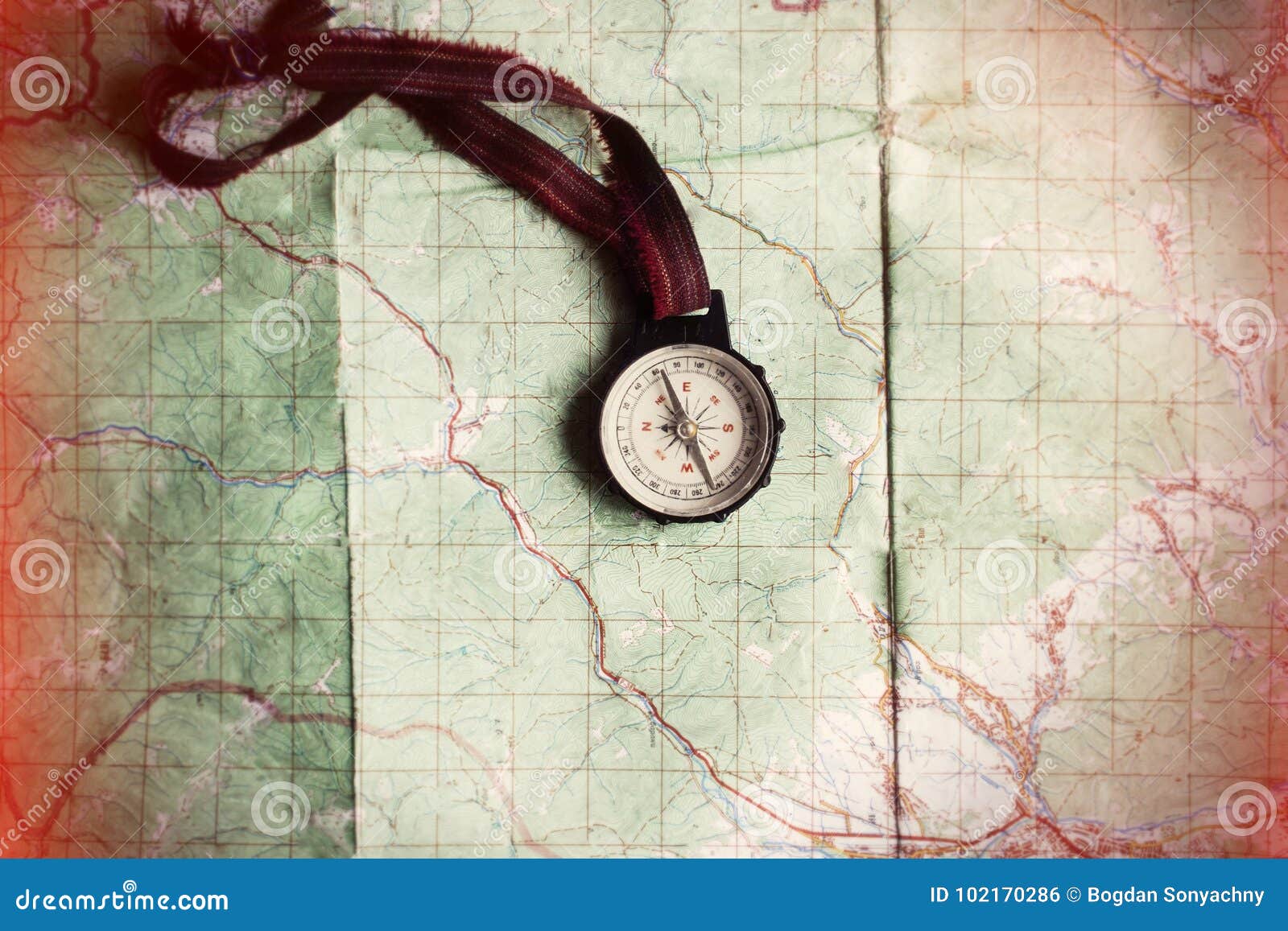 Wanderlust and Explore Concept, Compass on Map, Top View, Vintage Toned ...