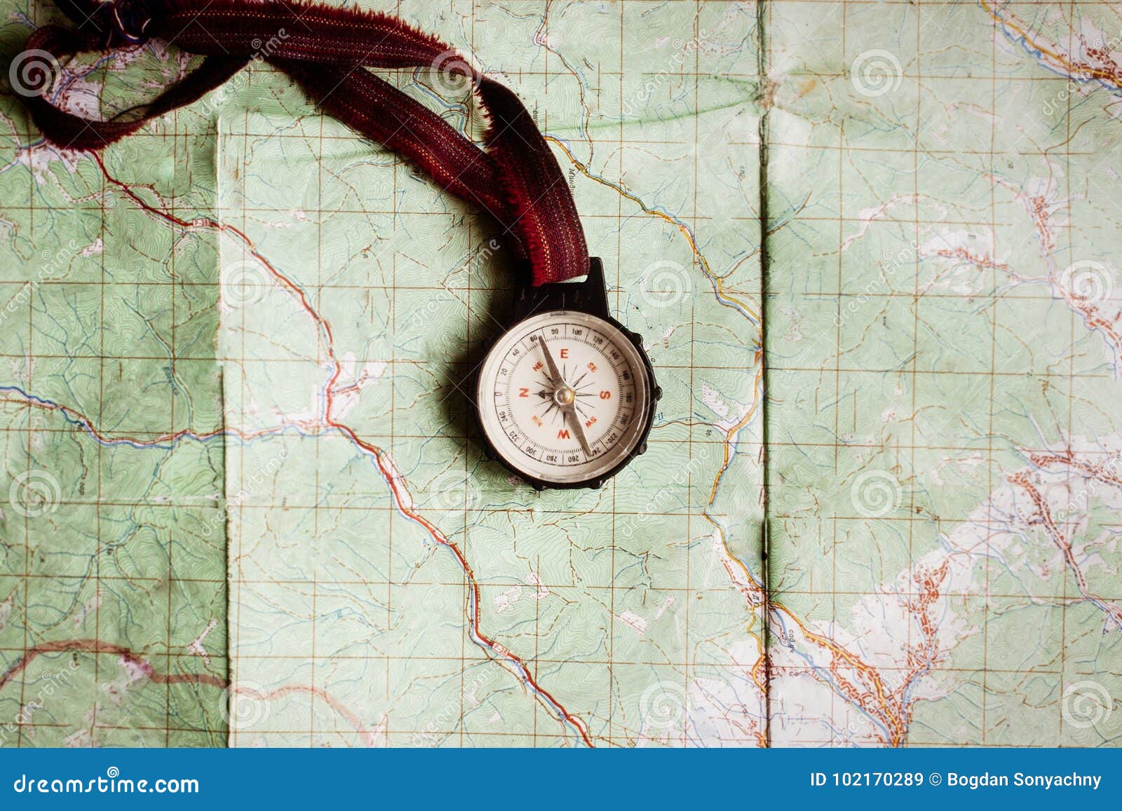 Wanderlust and Explore Concept, Compass on Map, Top View, Vintage Toned ...