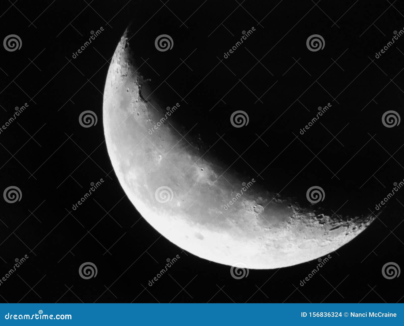 Waning Crescent in the Early Morning Sky Stock Photo - Image of craters ...