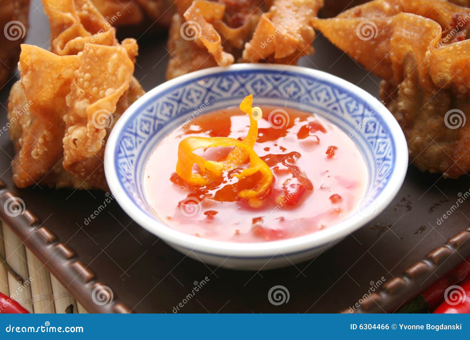 Wantons and bowl of chili stock photo. Image of closeup - 6304466