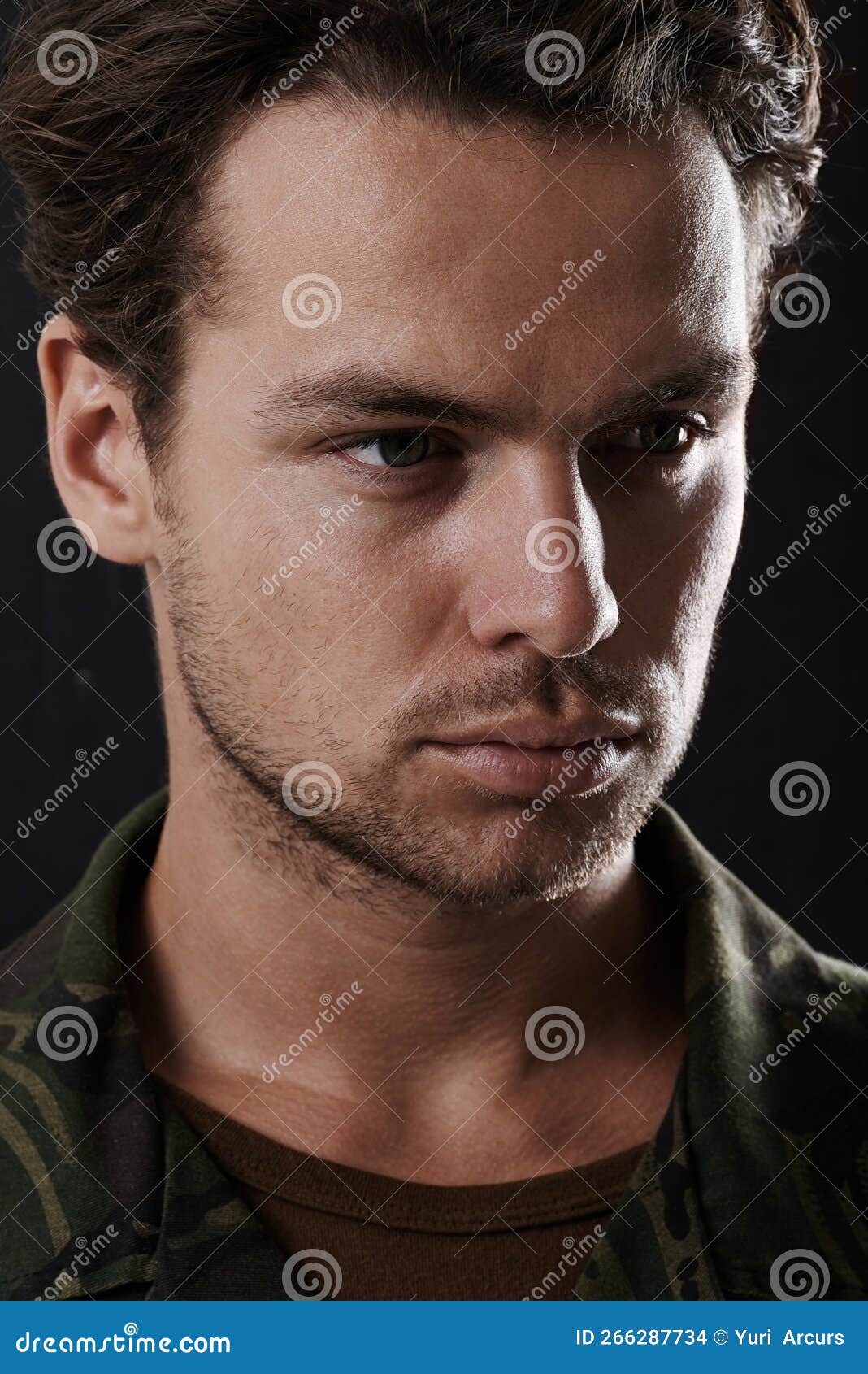 War Changes a Man. Cropped View of a Man in Fatigues Looking Serious ...