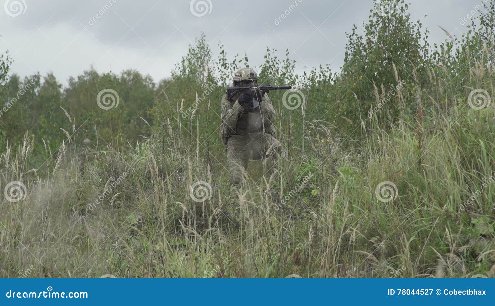War in the Grass Attacking Enemy. Soldier Shoots in a Field Stock Video ...