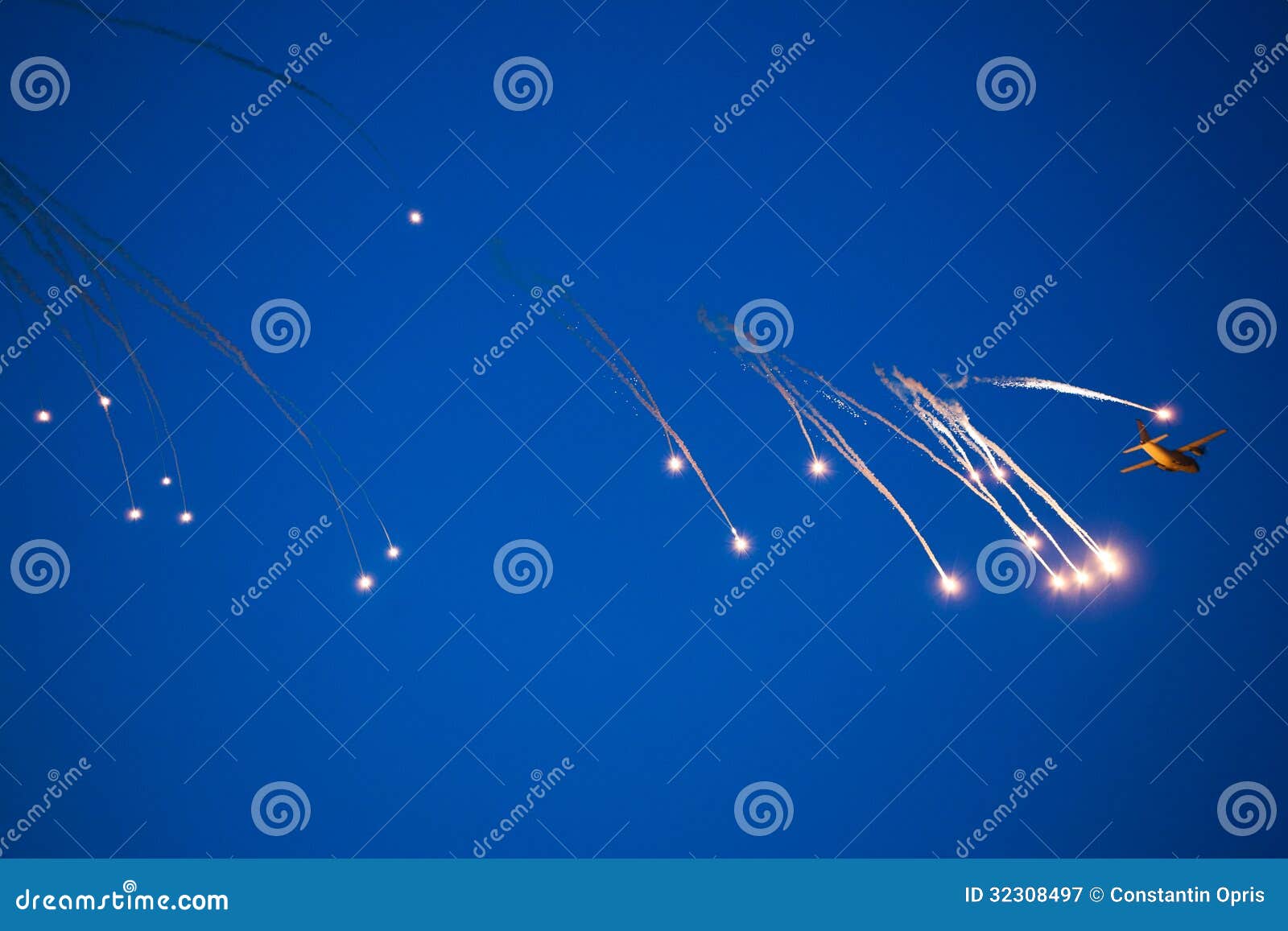 War plane dropping flares stock image. Image of flying - 32308497
