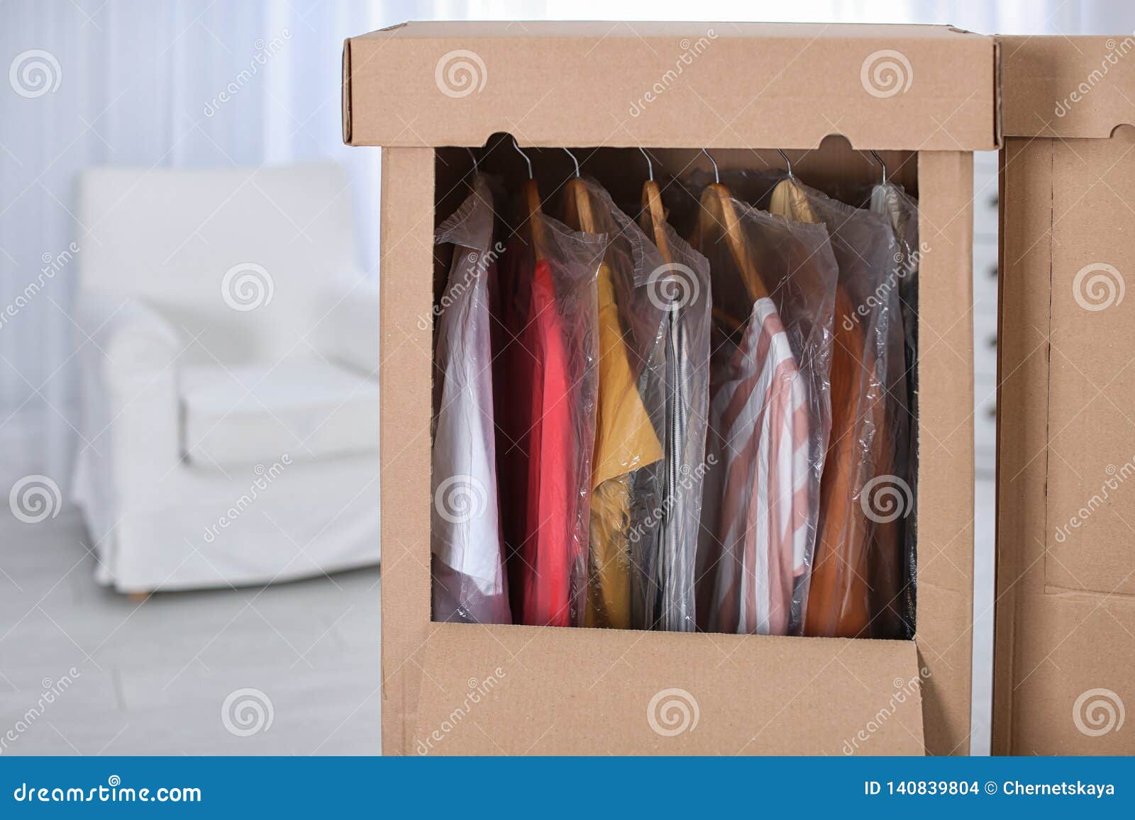 Wardrobe Boxes with Clothes in Room Stock Photo - Image of collection ...