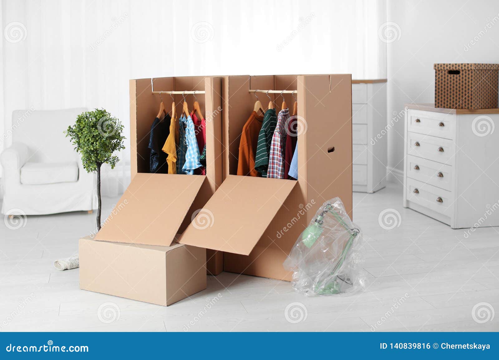 Wardrobe Boxes with Clothes in Room Stock Photo - Image of colorful ...