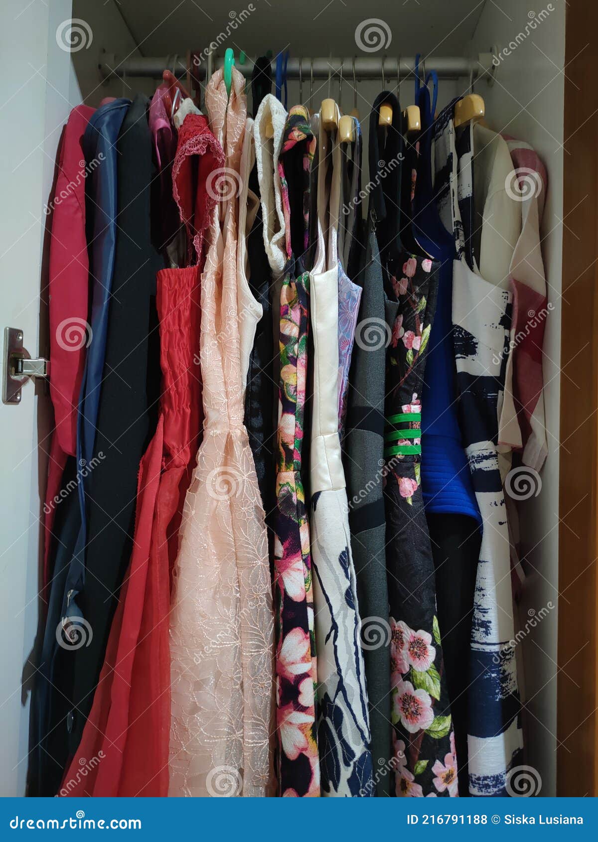 Wardrobe full of dresses stock photo. Image of shopping - 216791188