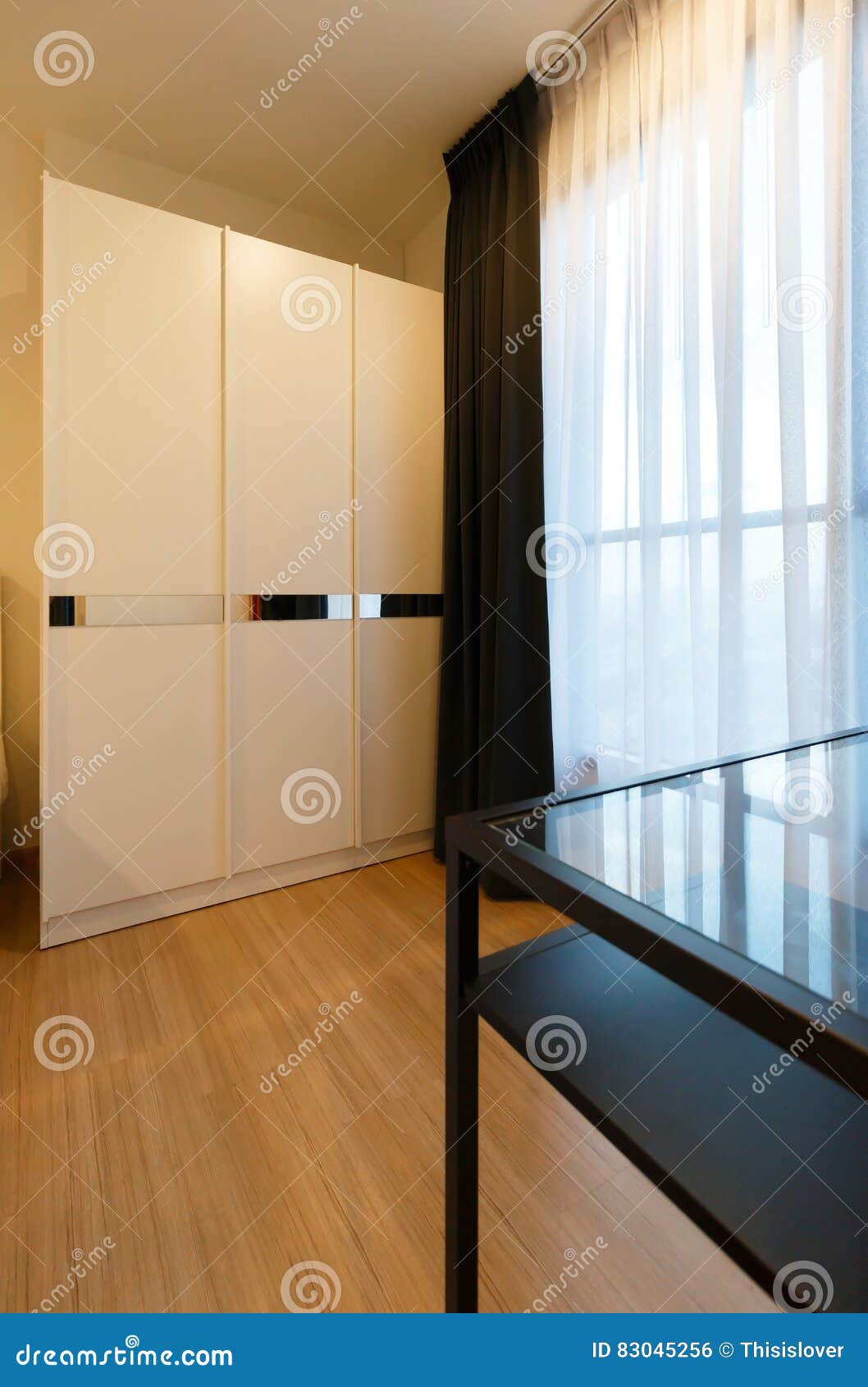 Wardrobe and table stock photo. Image of room, home, light - 83045256