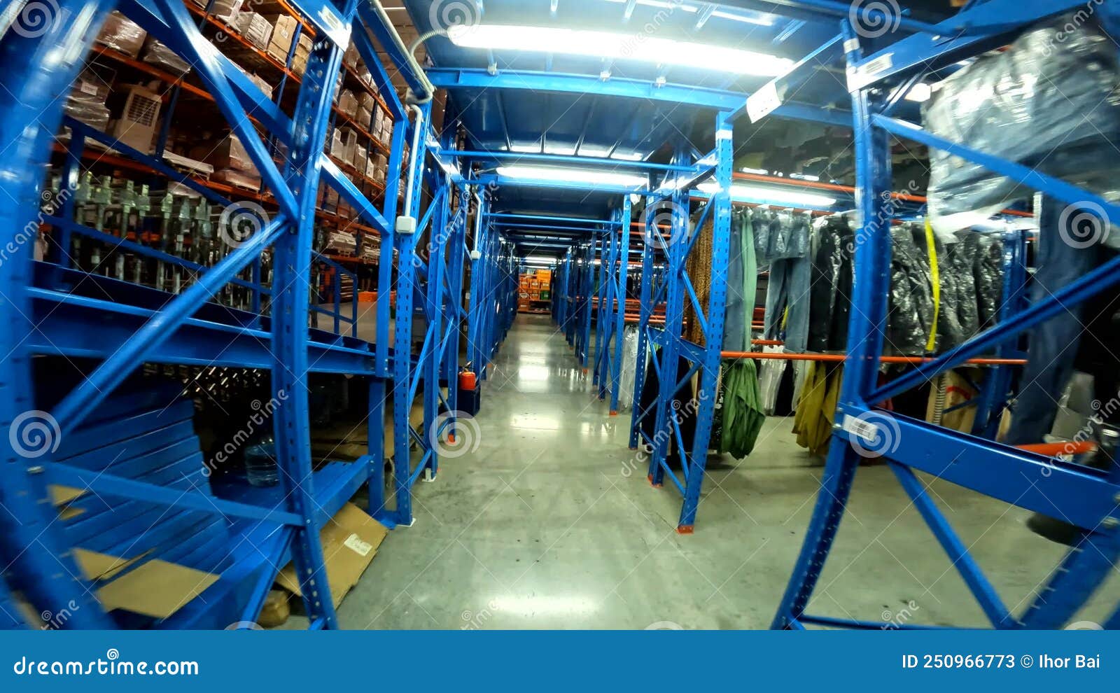 The Clothes are Hung in Rows in the Warehouse. Warehouse with Clothes ...