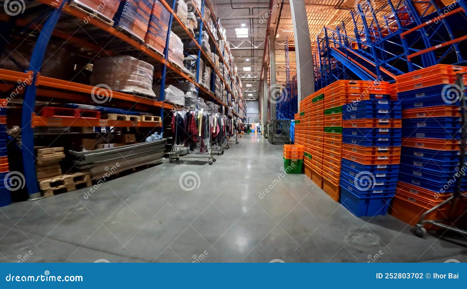Clothes in the Warehouse of the Factory. Industrial Interior. the ...
