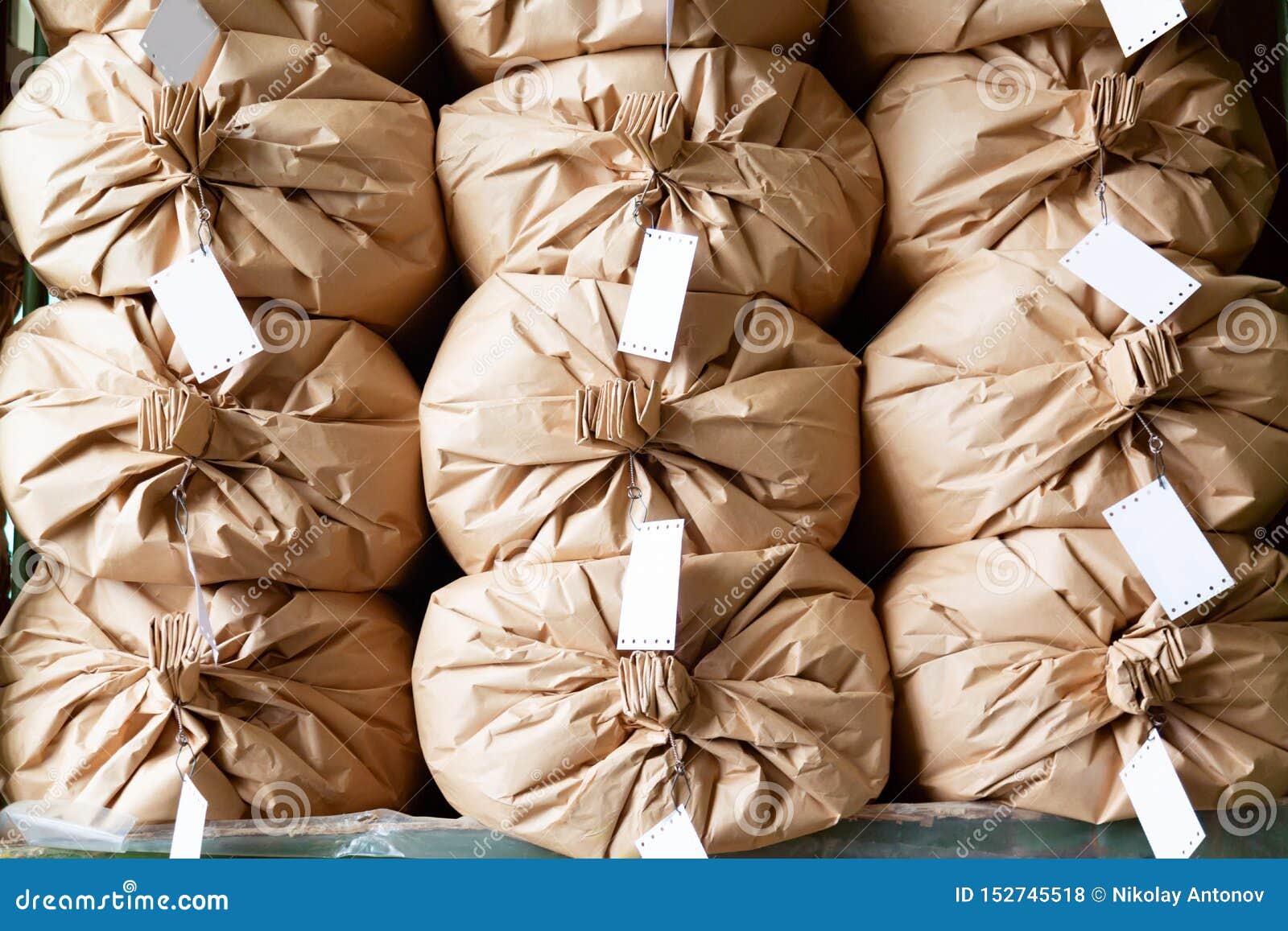 Warehouse Concept. Stacked Paper Sacks in a Warehouse Stock Photo ...