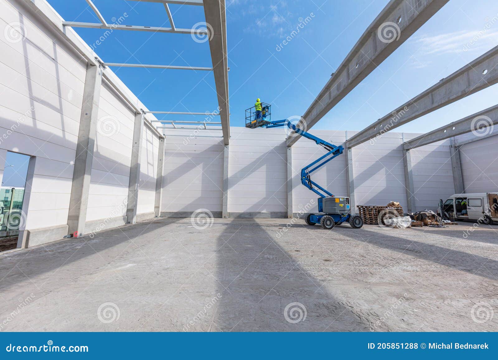Warehouse Construction. Worker on Mobile Elavating Work Platform Stock ...