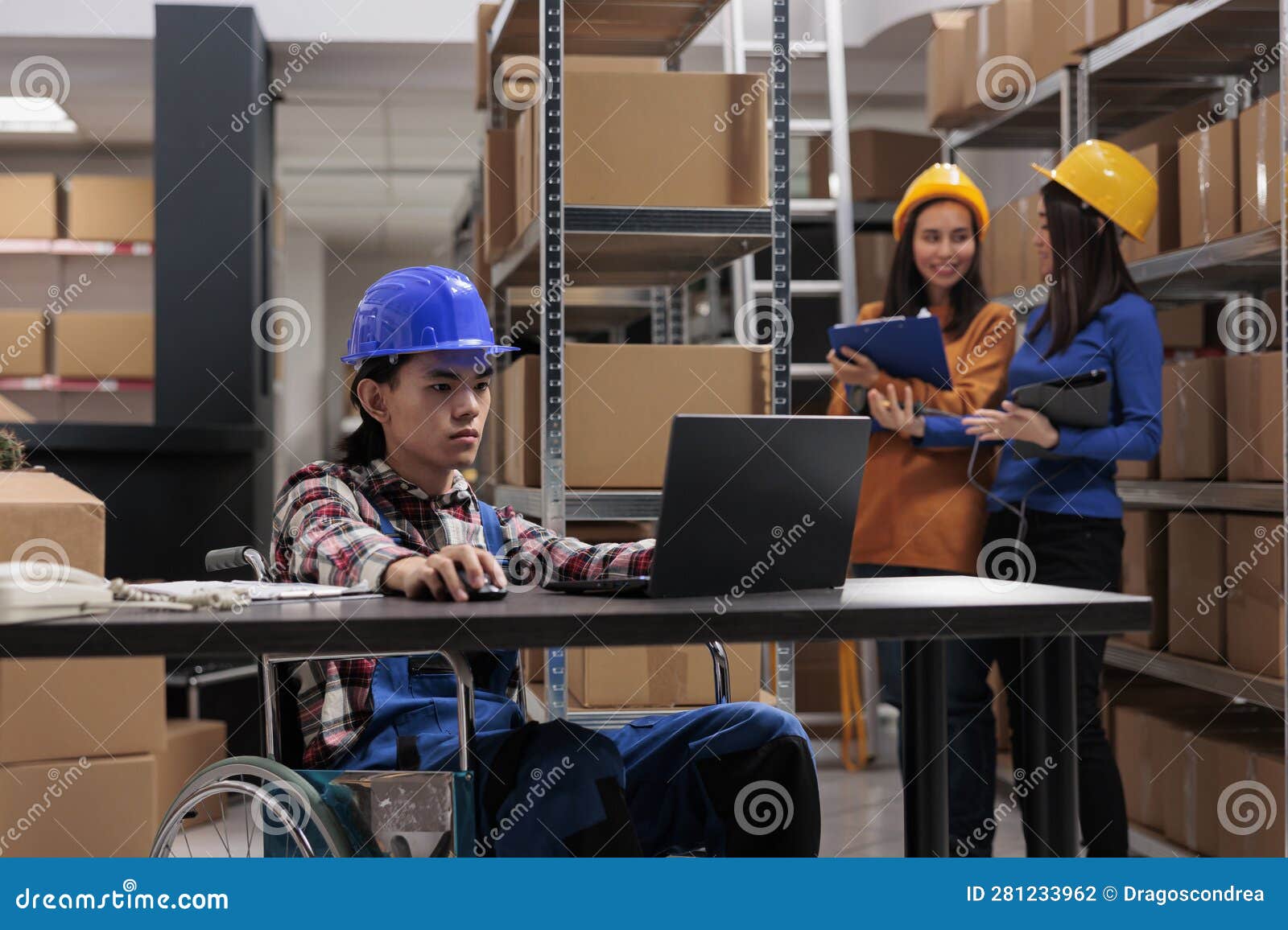 Warehouse Employee in Wheelchair Doing Inventory Optimization on Laptop Stock Photo - Image of ...