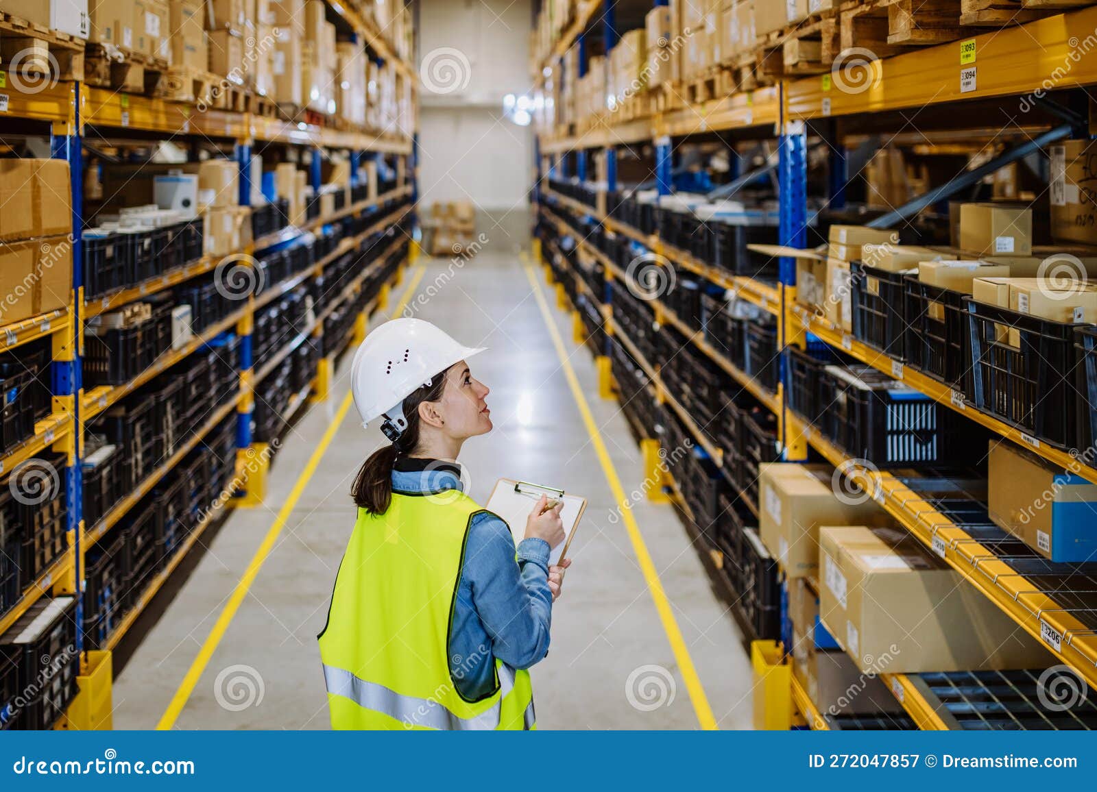 Warehouse Female Worker Checking Up Stuff in a Warehouse. Stock Image ...