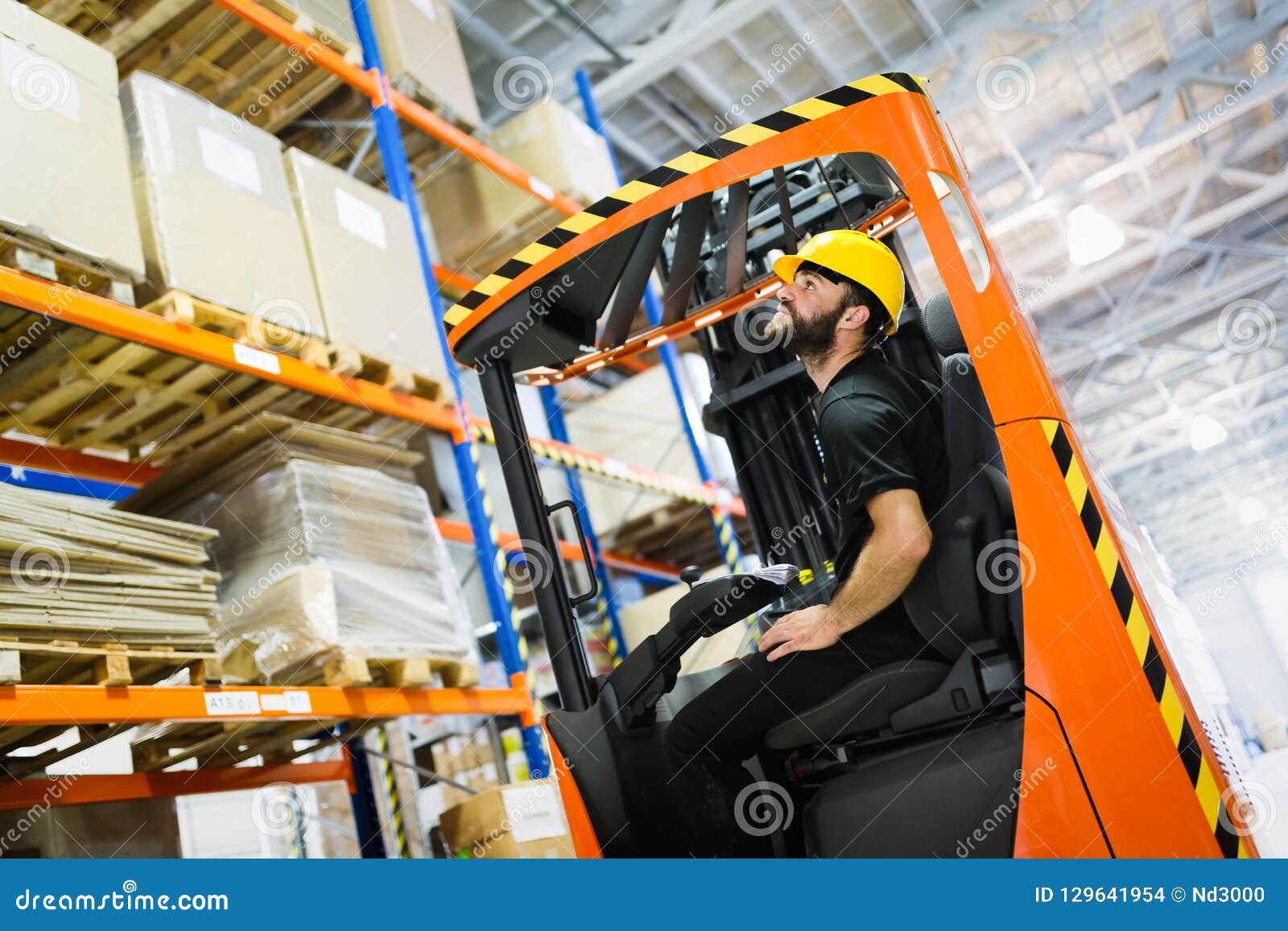 Warehouse Worker Doing Logistics Work with Forklift Loader Stock Photo ...