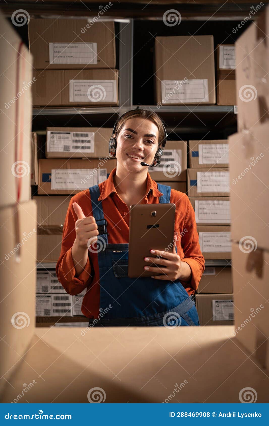 Warehouse Inventory Manager Using Digital Tablet Showing Thumbs Up ...