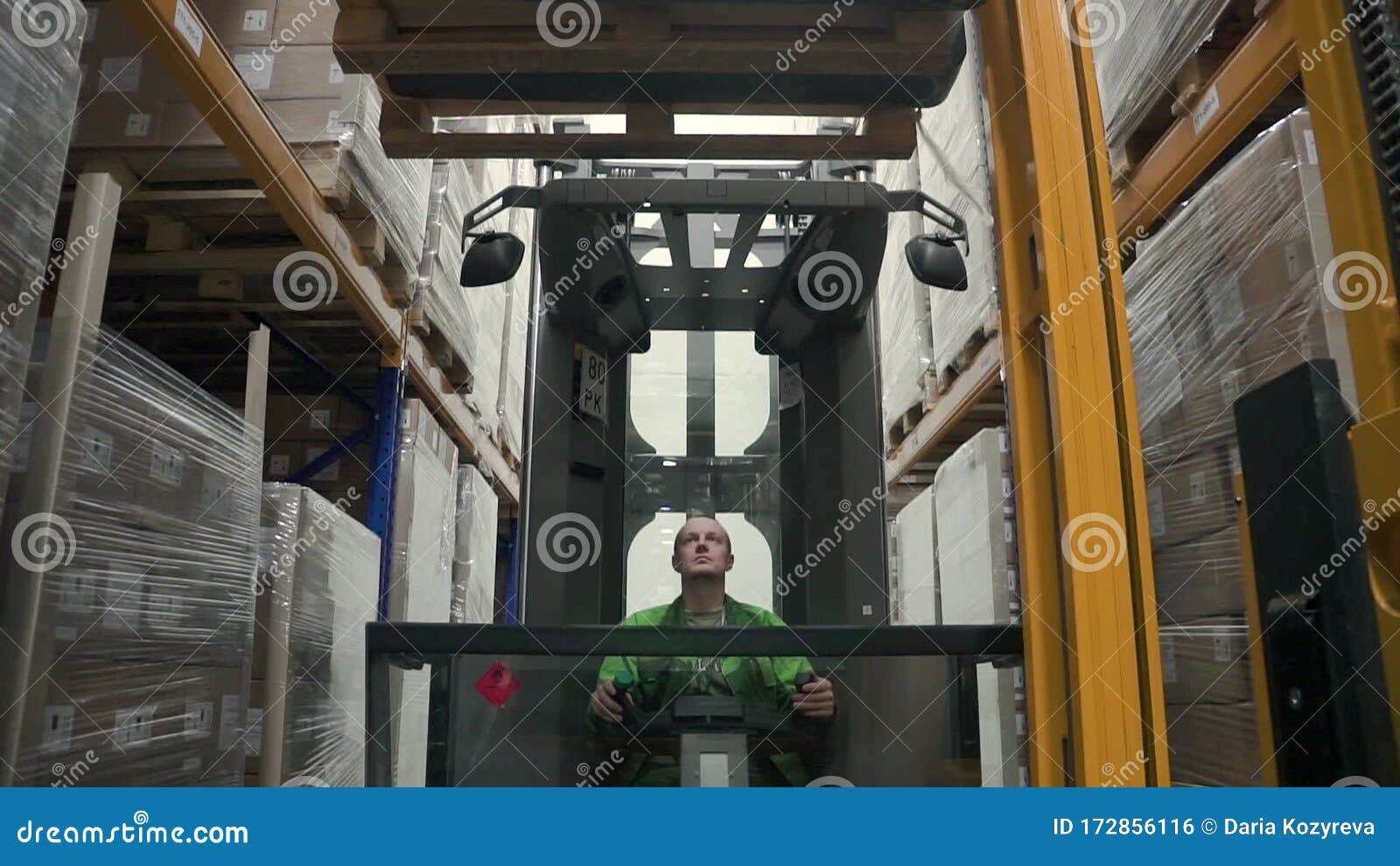 Warehouse Male Worker at Forklift. Loader Unload Goods from Shelf Stock ...