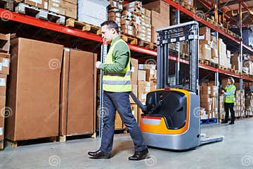Warehouse Management System. Workers with Barcode Scanner and Stacker ...