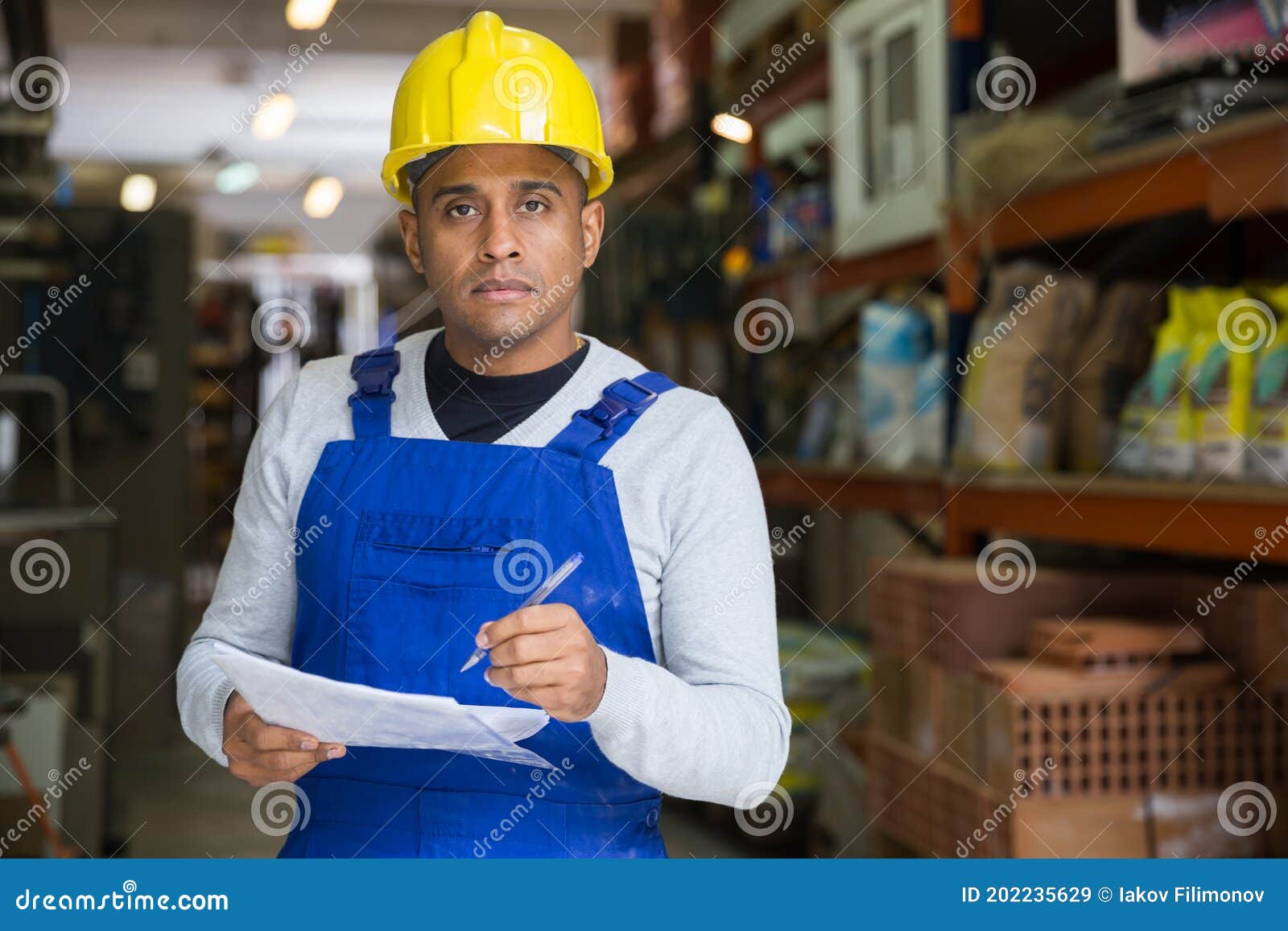 Warehouse Manager Calculates the Quantity of Goods and Writes it Down ...