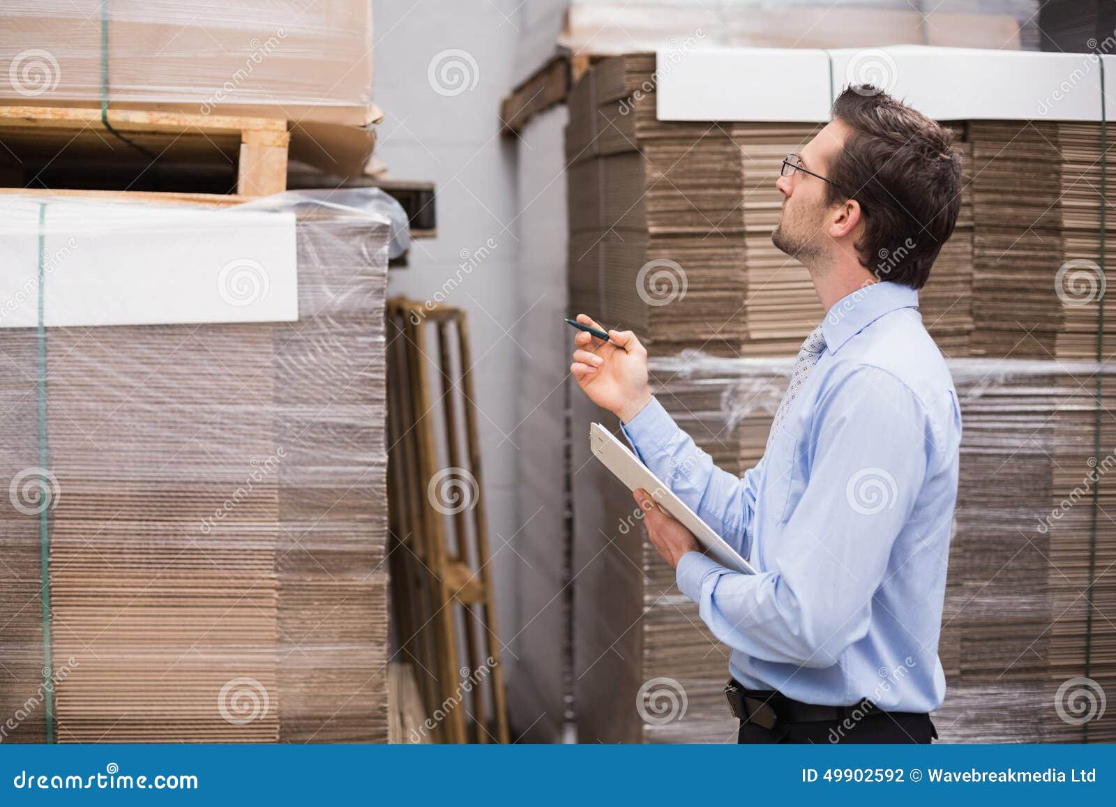 Warehouse Manager Checking His Inventory Stock Photo - Image of focused ...