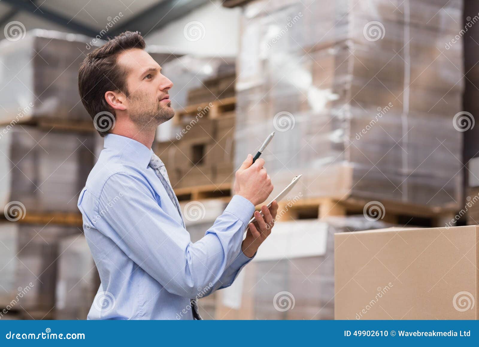 Warehouse Manager Checking His Inventory Stock Photo - Image of ...