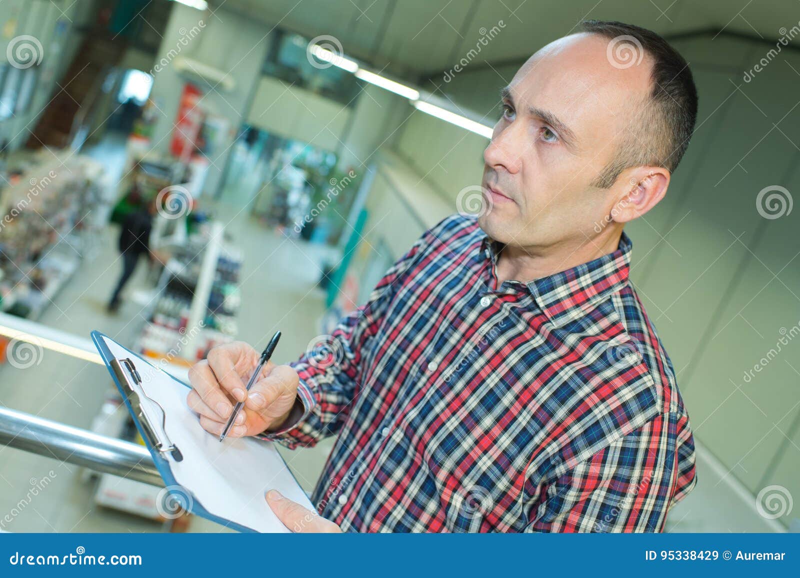 Warehouse Manager Checking Inventory in Large Warehouse Stock Image ...