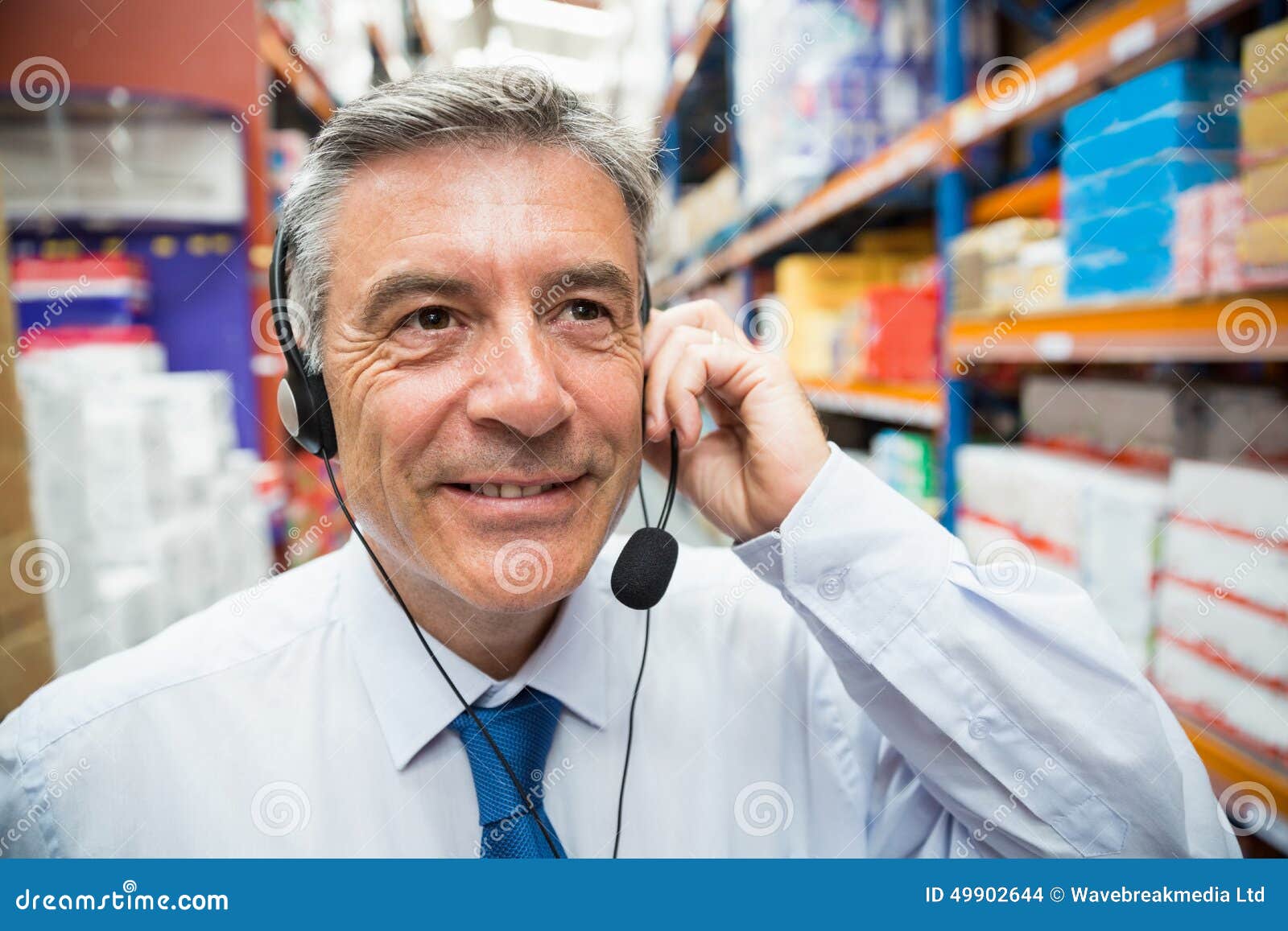 Warehouse Manager Giving Orders on Headset Stock Photo - Image of ...