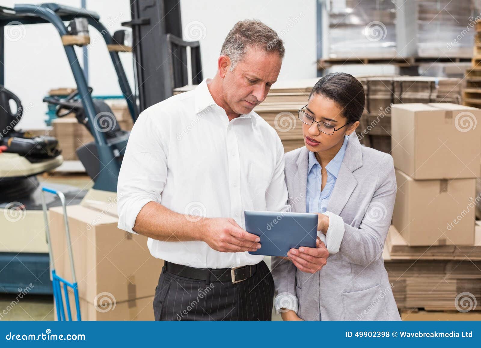 Warehouse Manager and Her Boss Working Together Stock Photo - Image of ...