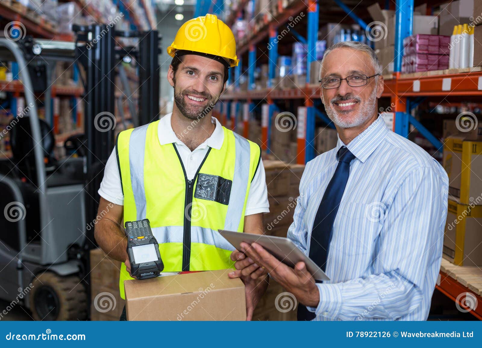 Warehouse Manager Holding Digital Tablet while Male Worker Scanning ...
