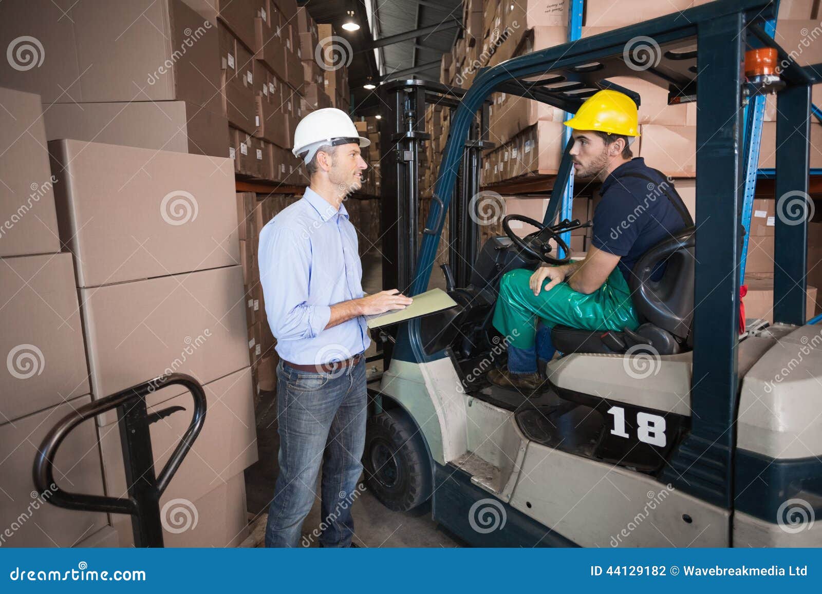 Warehouse Manager Talking with Forklift Driver Stock Photo - Image of ...