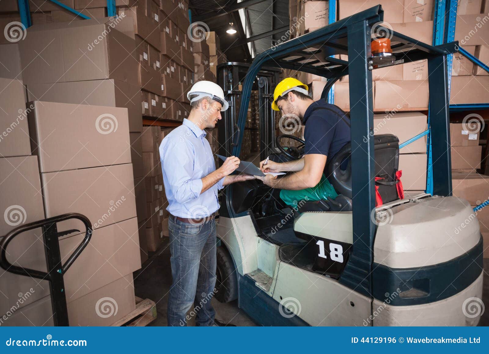 Warehouse Manager Talking with Forklift Driver Stock Photo - Image of ...