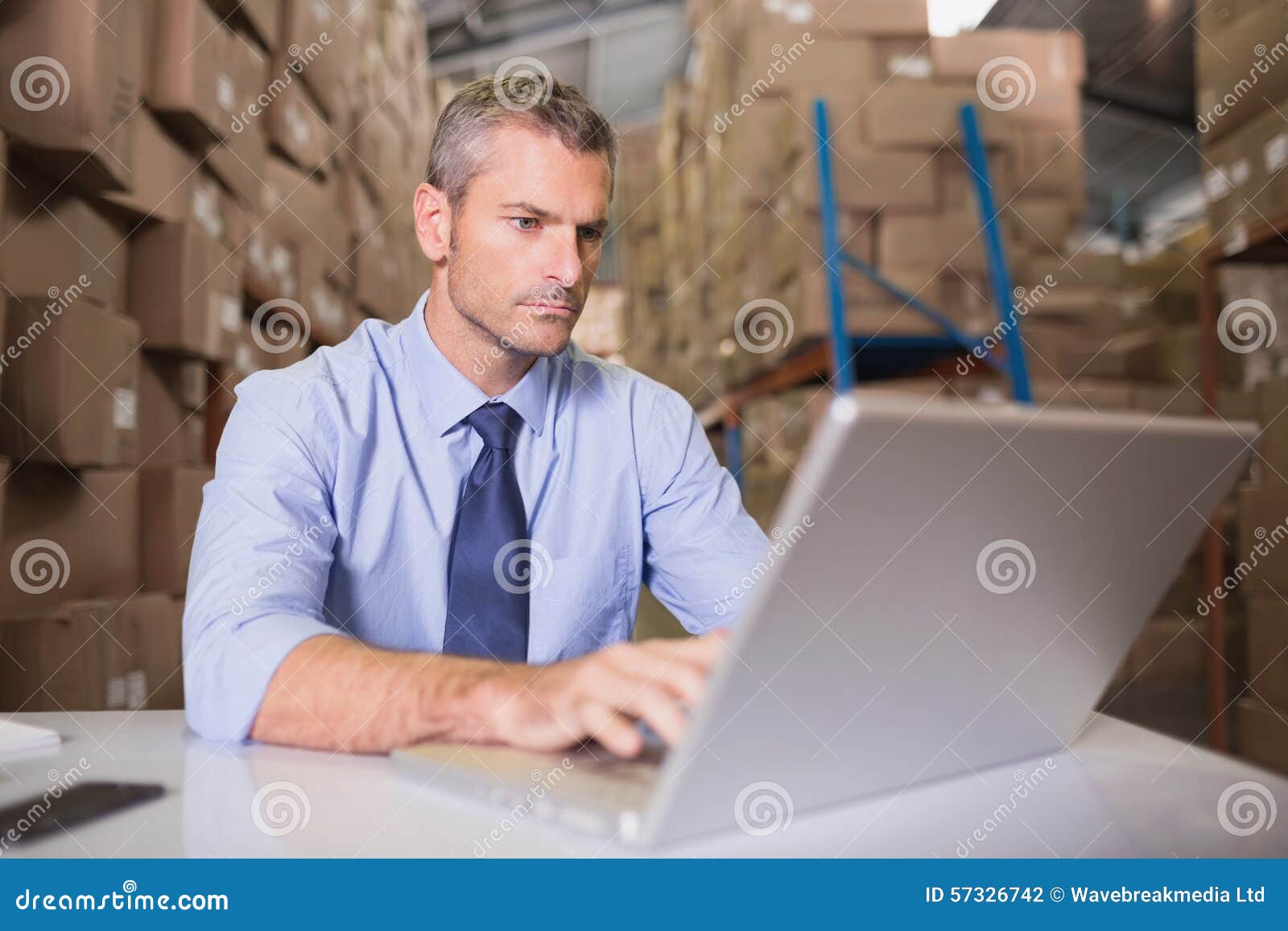 Warehouse Manager Using Laptop Stock Photo - Image of adult, male: 57326742