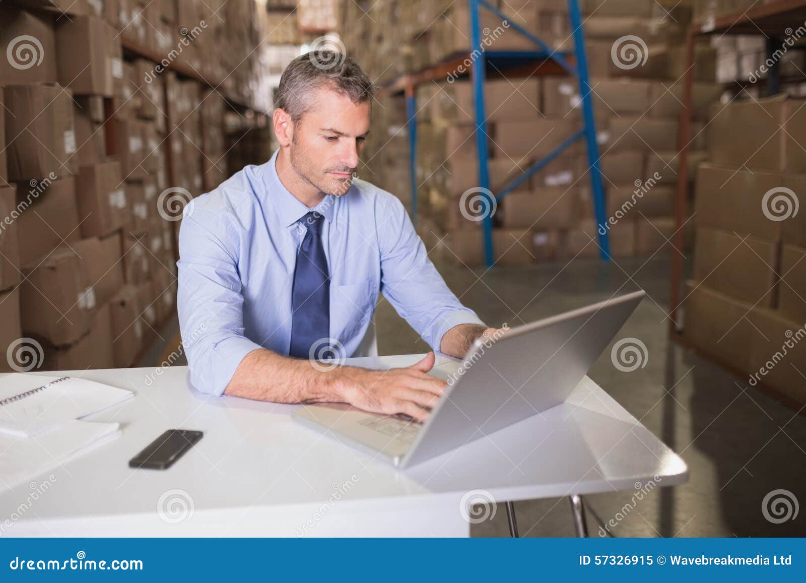 Warehouse Manager Using Laptop Stock Image - Image of cardboard, table ...