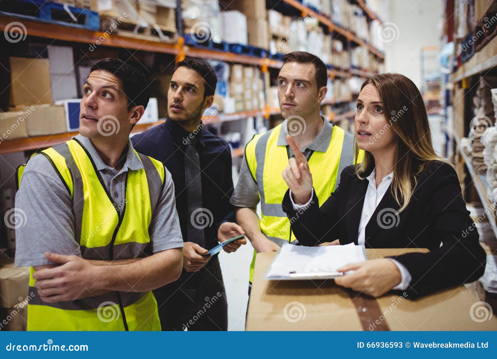 Warehouse Manager and Workers Talking Stock Image - Image of serious ...