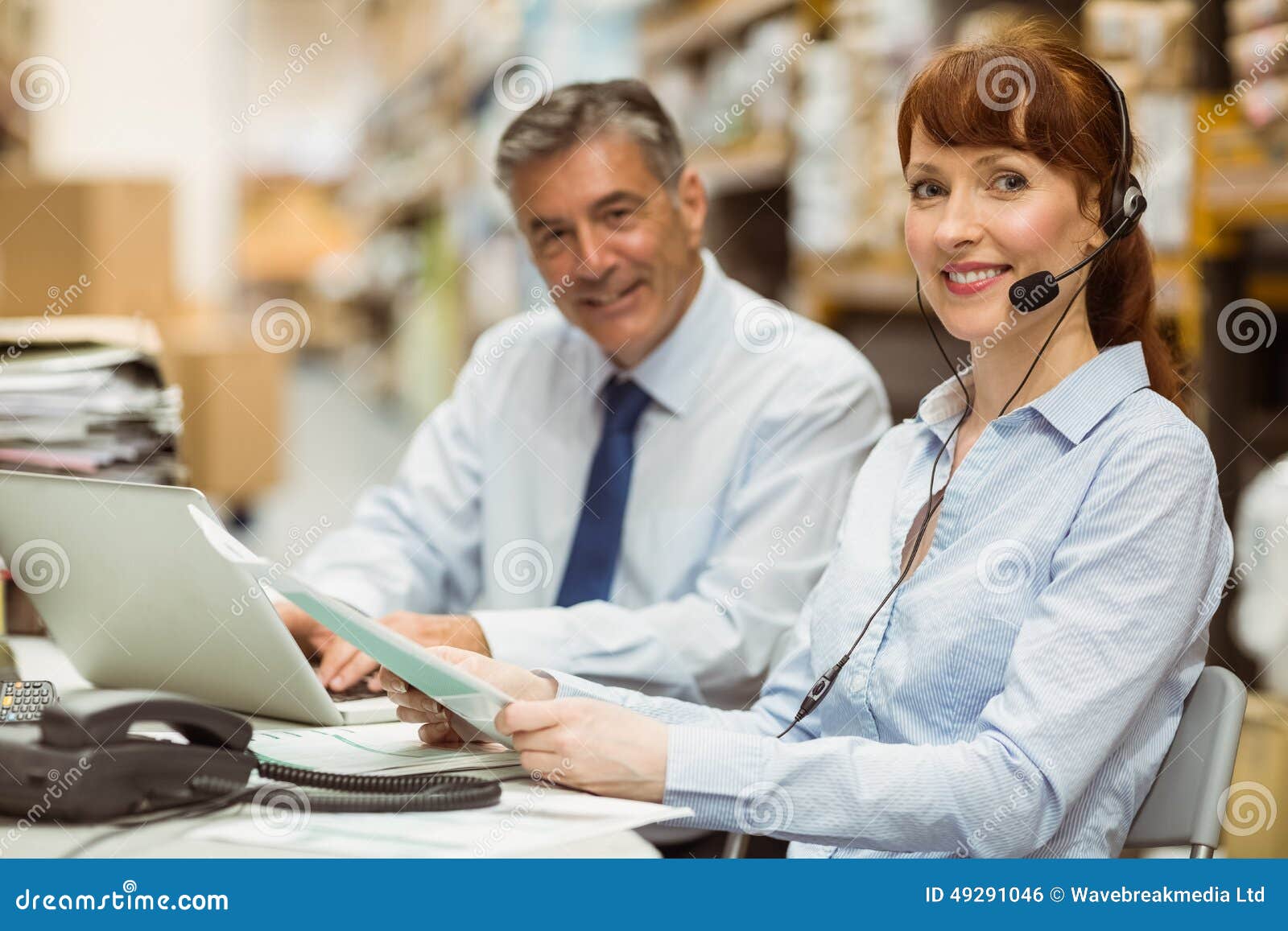 Warehouse Manager Working at Her Desk Wearing Headset Stock Photo ...