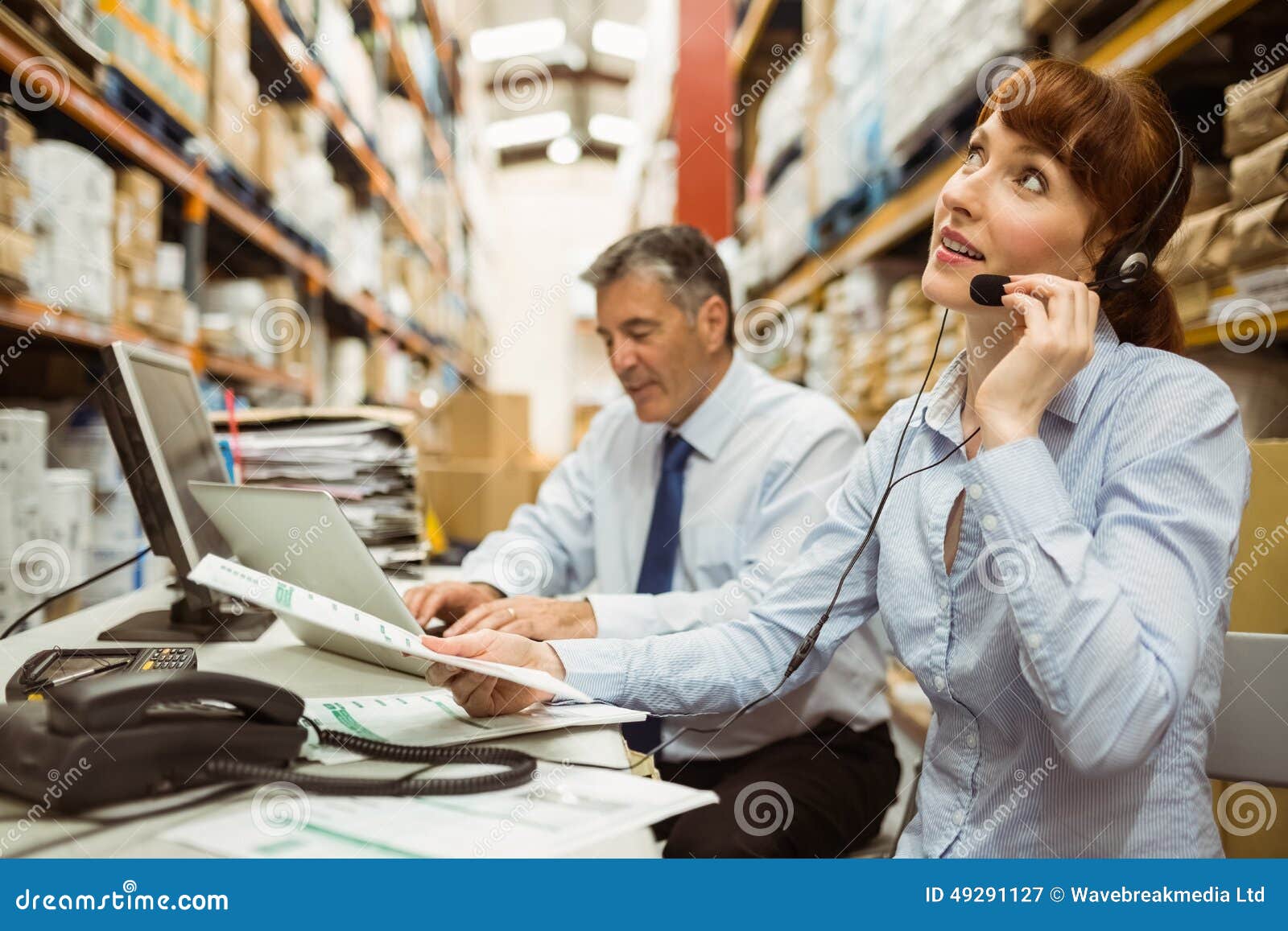 Warehouse Manager Working at Her Desk Wearing Headset Stock Image ...